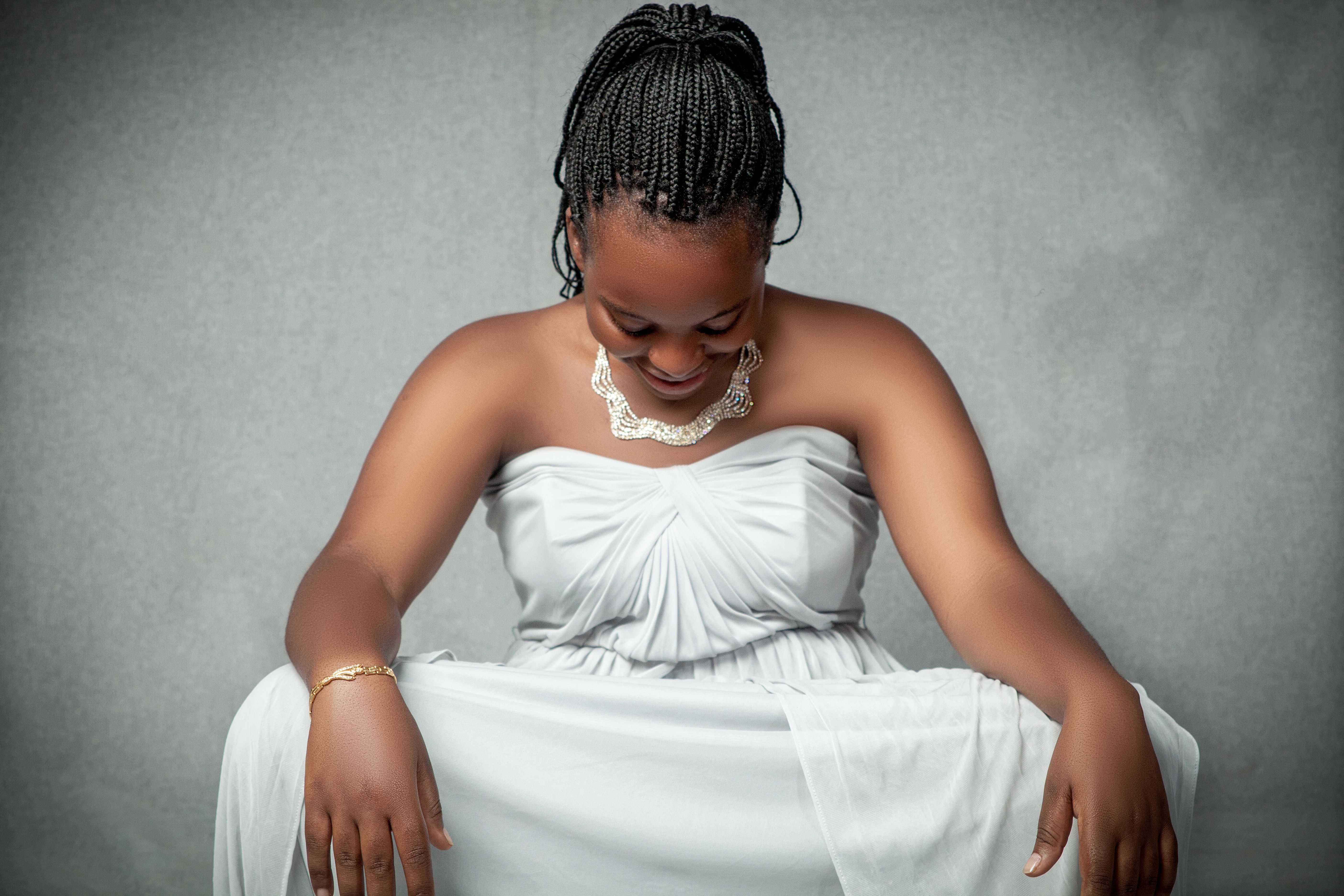 Elegant Portrait of a Woman in White Dress · Free Stock Photo