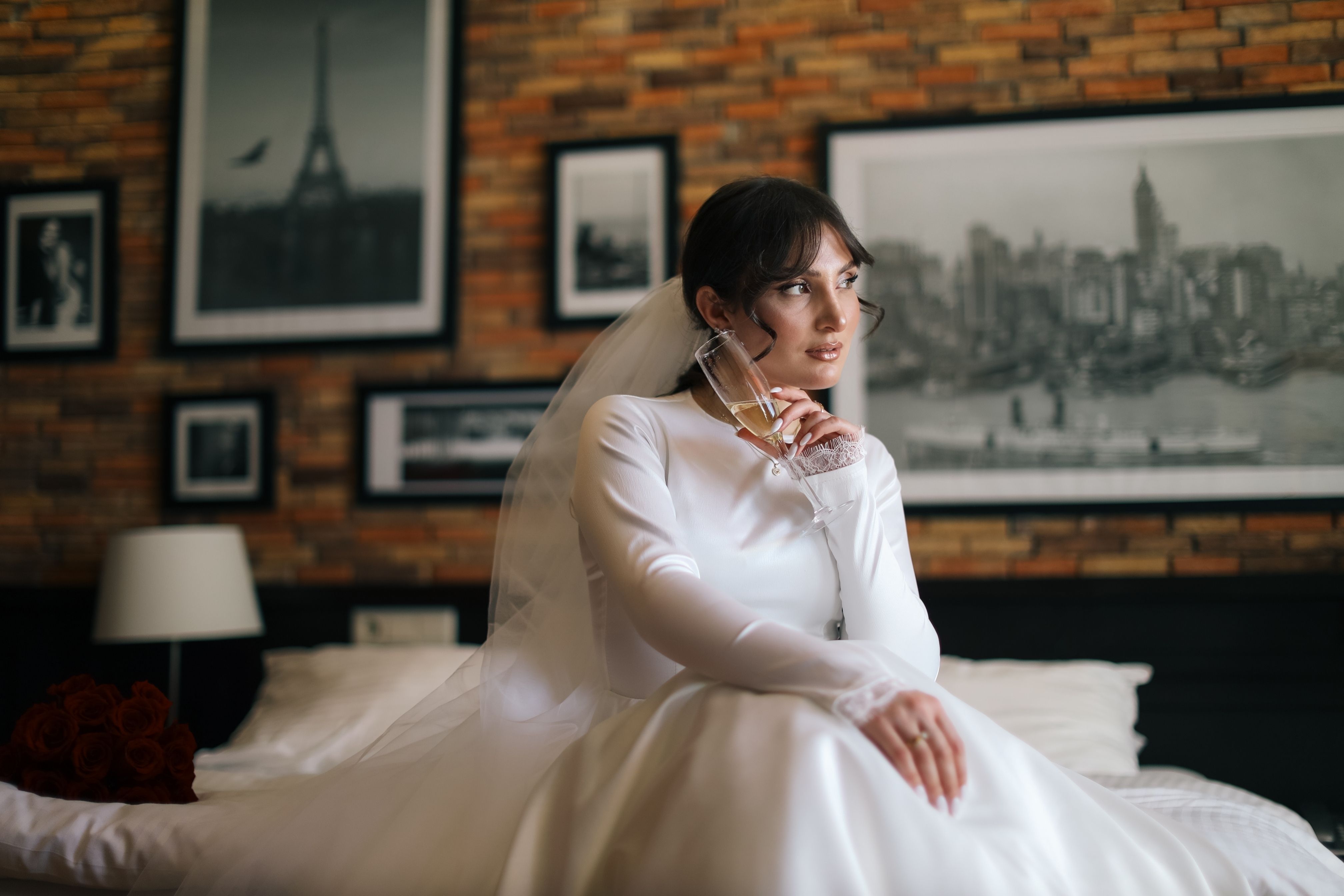 Elegant Bride in Hotel Room Holding Champagne Glass · Free Stock Photo