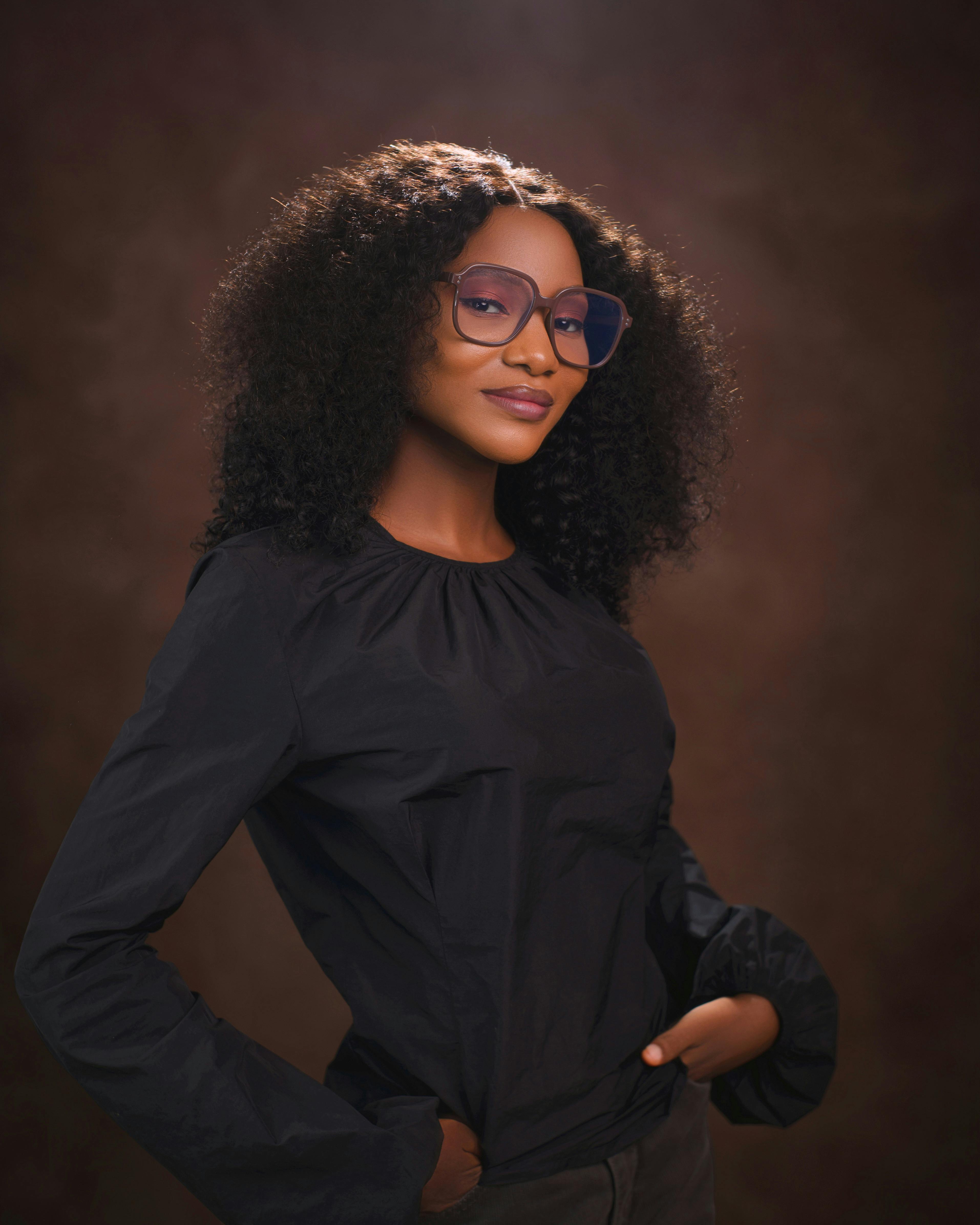 Confident Woman in Stylish Outfit Studio Portrait · Free Stock Photo