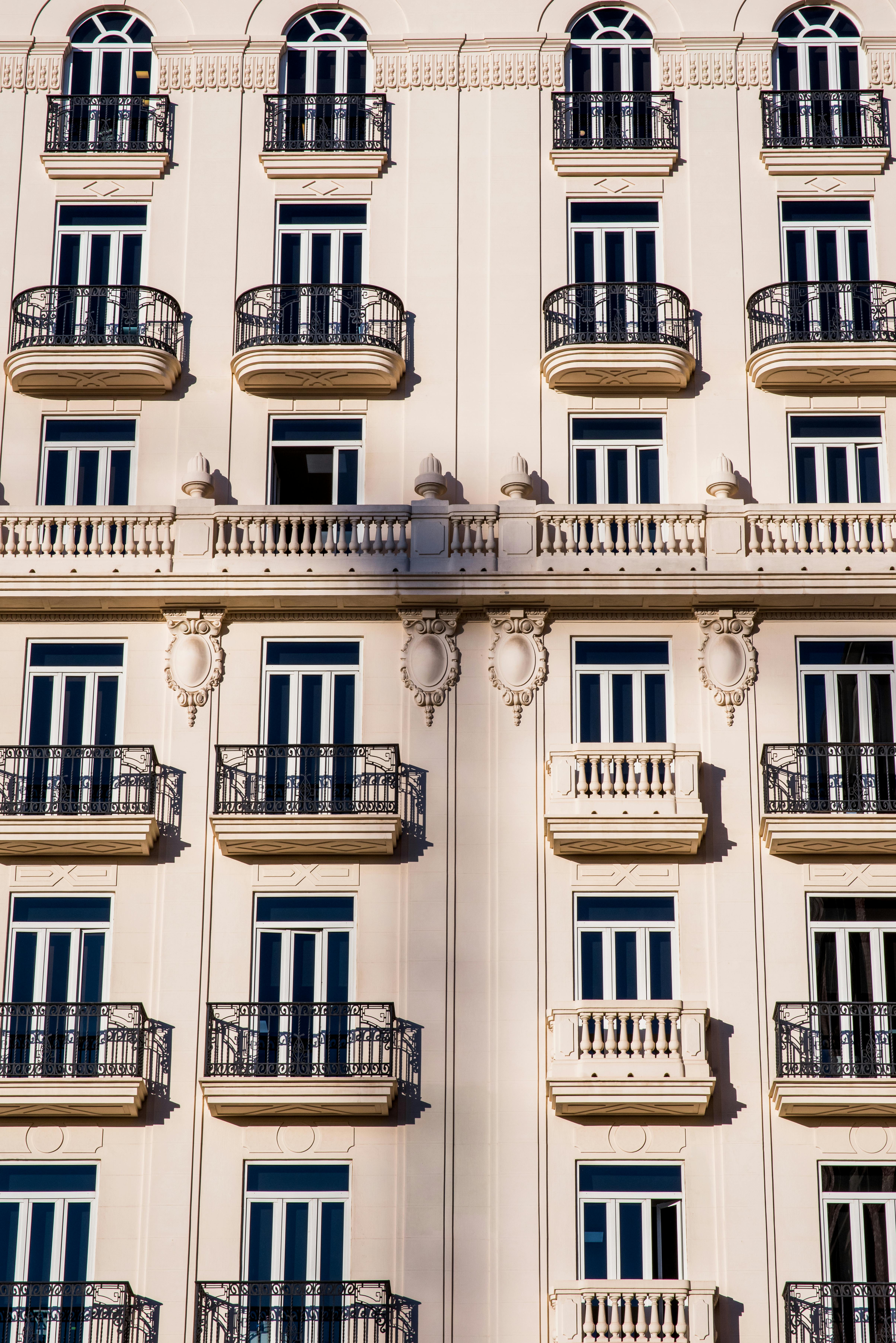 Elegant Classic Building Facade with Balconies · Free Stock Photo