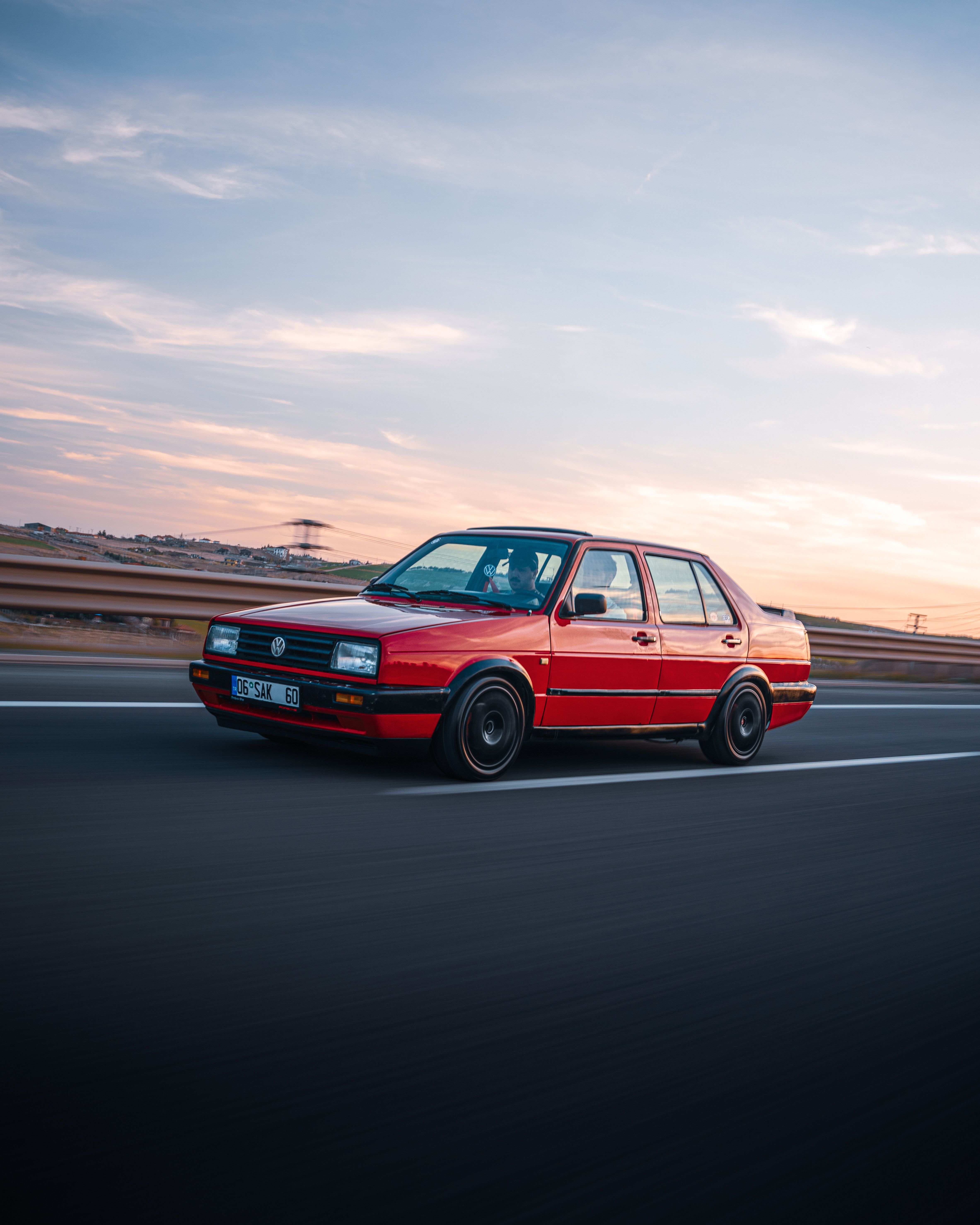Classic Red Car Driving at Sunset in Ankara · Free Stock Photo