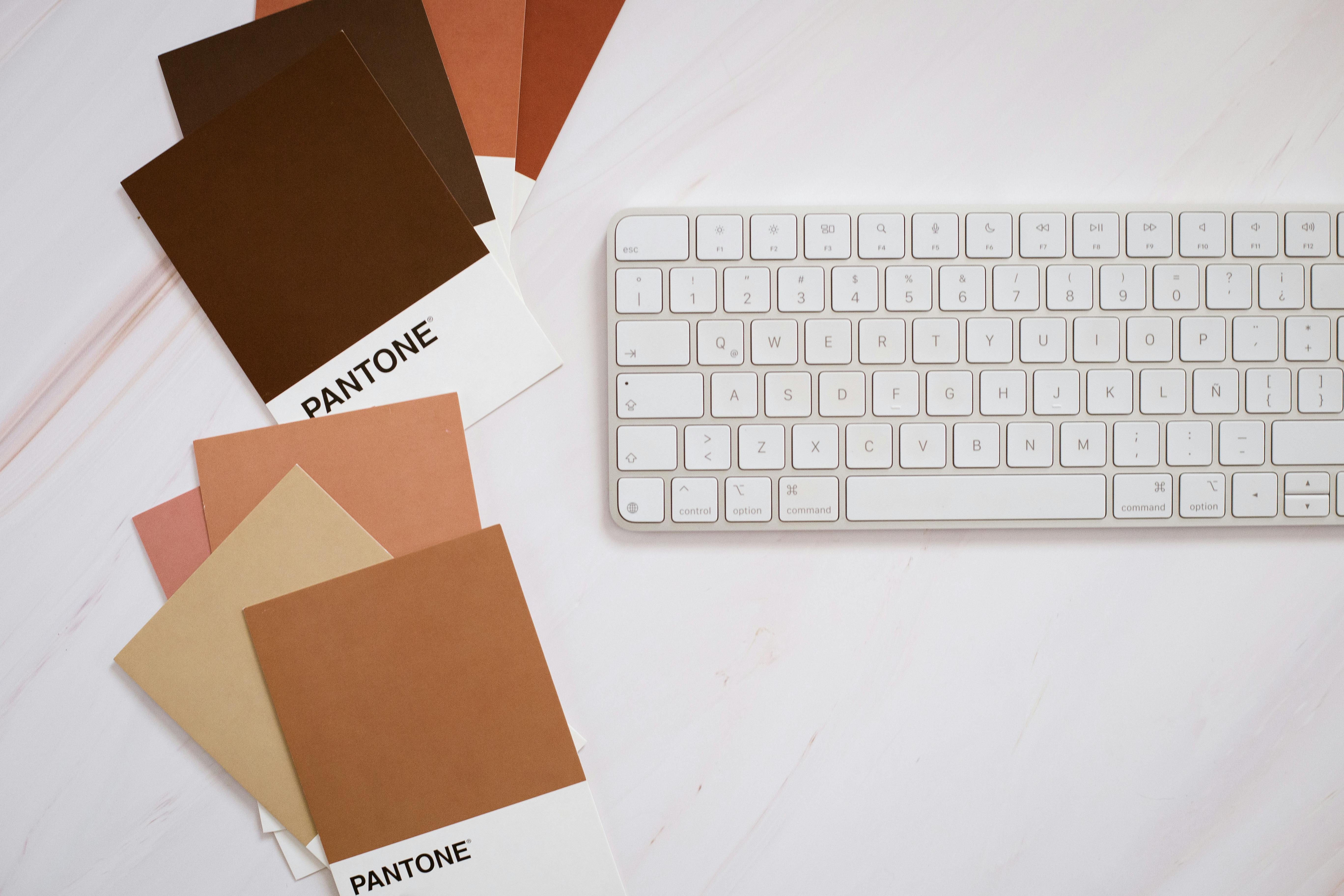 Elegant Composition of Pantone Cards and Keyboard · Free Stock Photo
