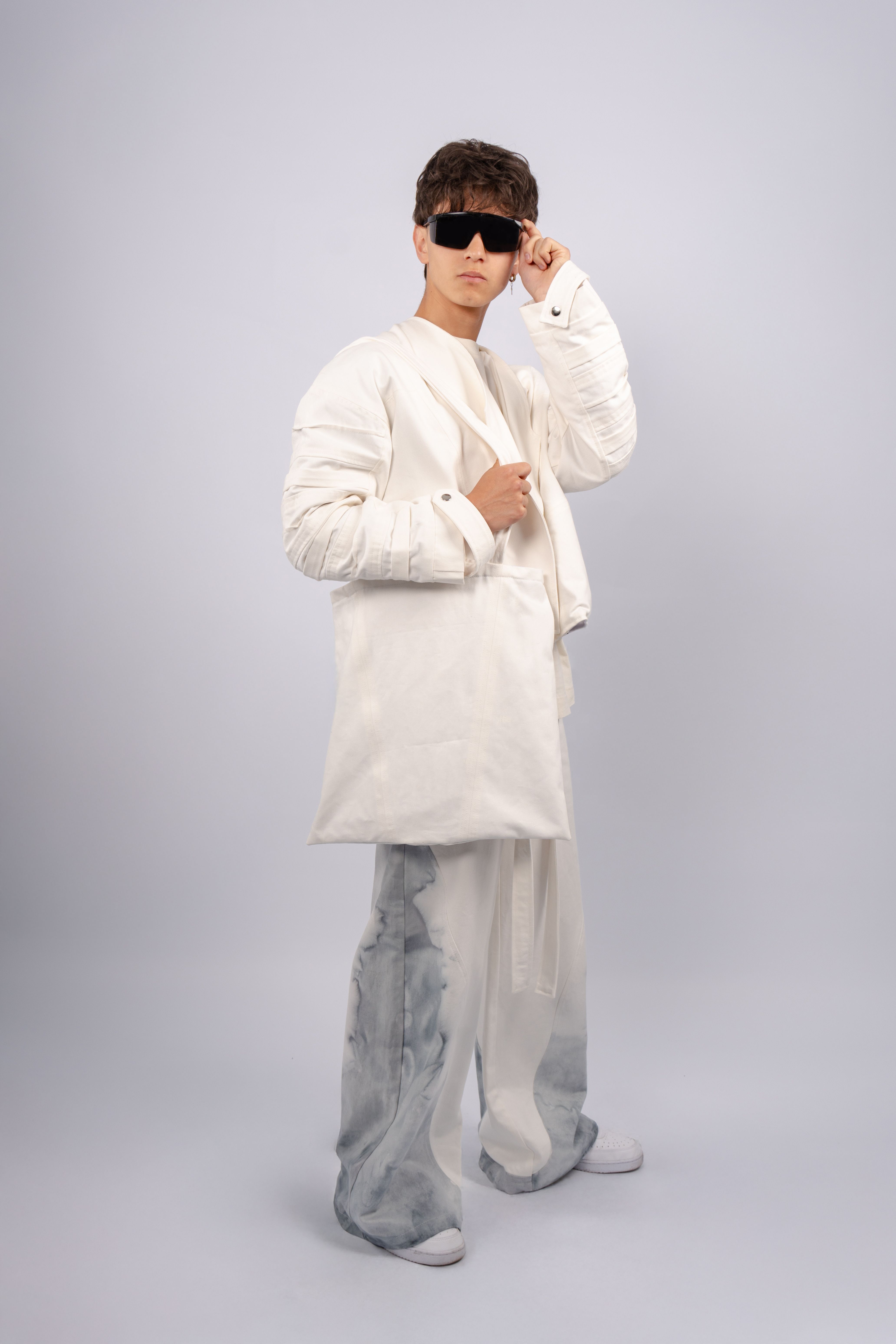 Stylish Man Posing in Artistic Urban Fashion · Free Stock Photo