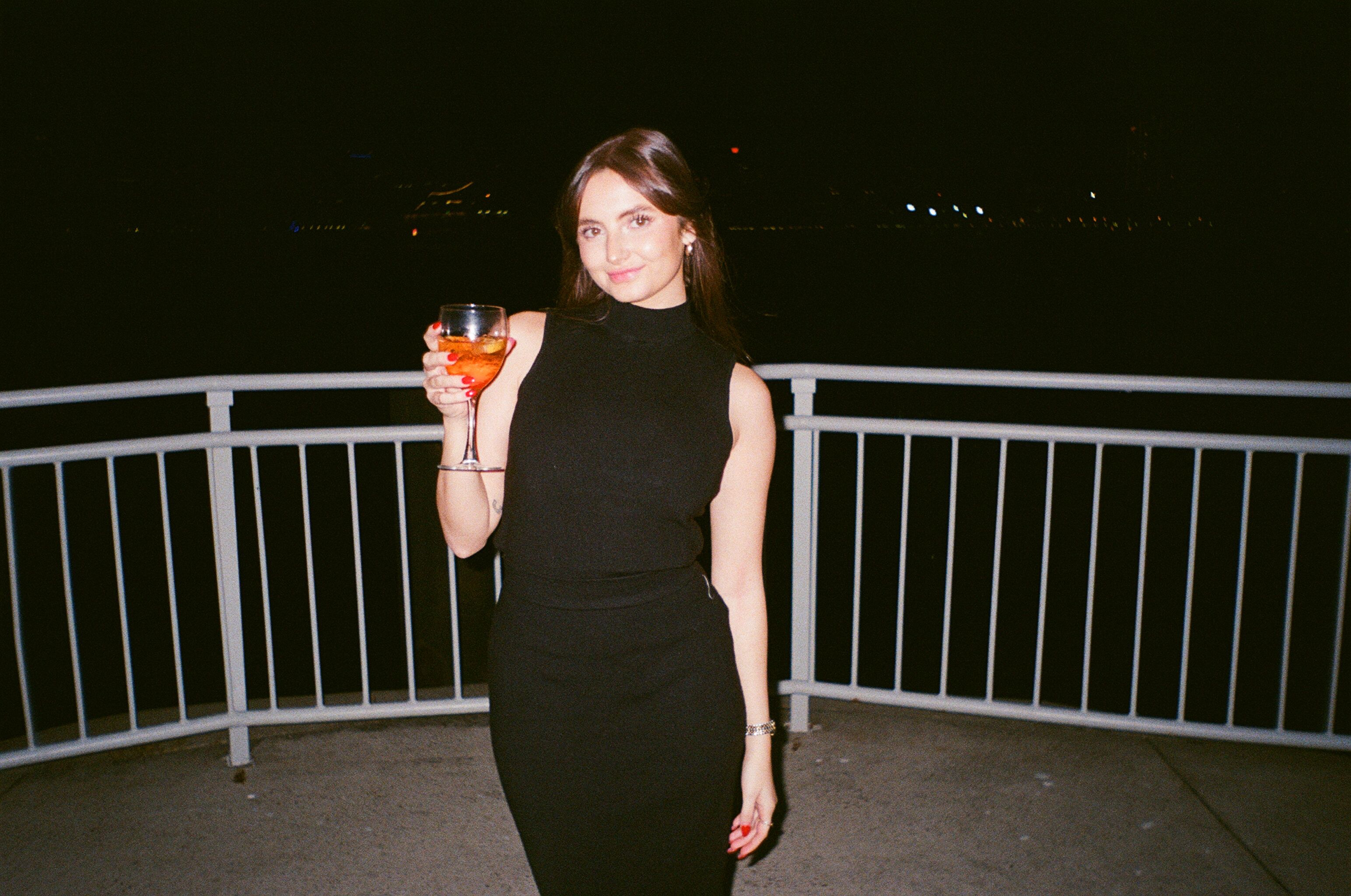 Elegant Woman Holding Cocktail at Night · Free Stock Photo