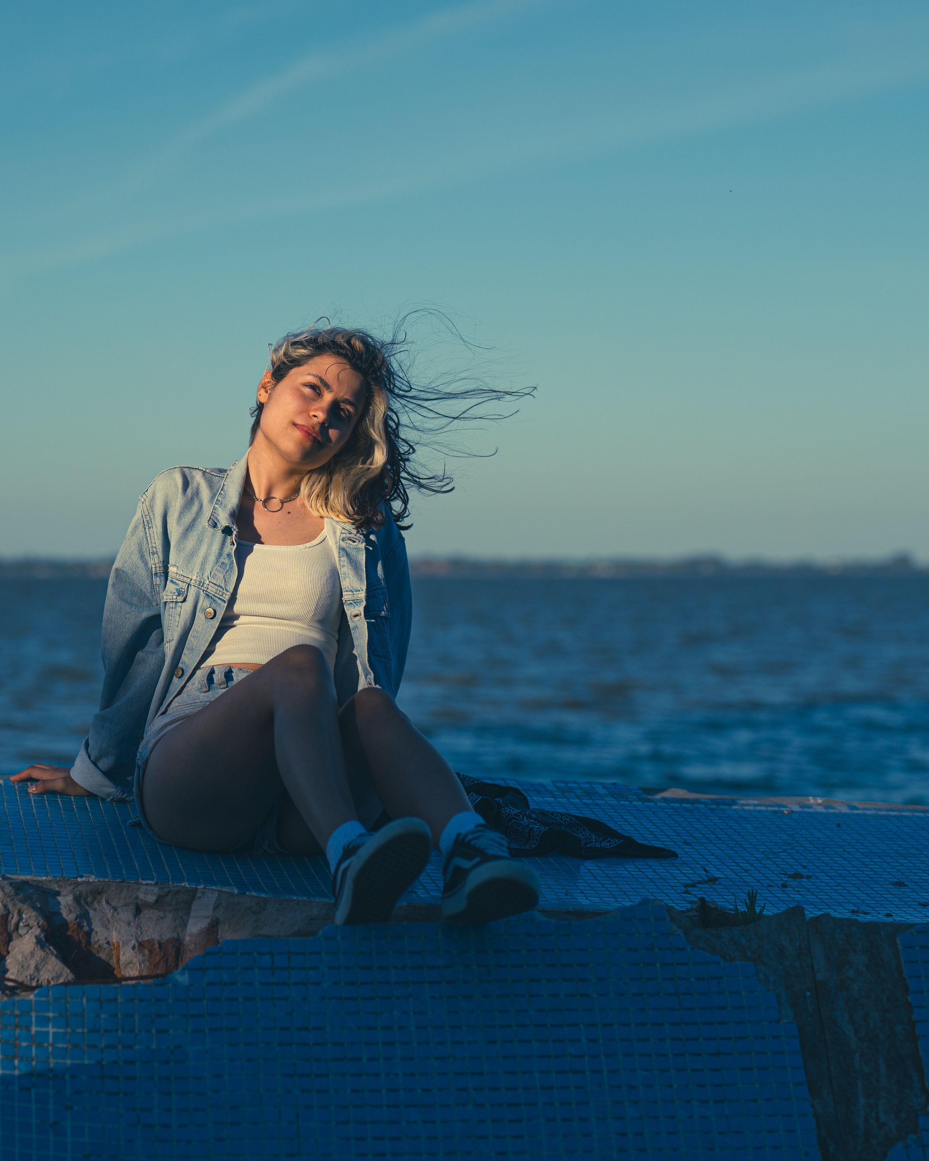 Relaxed Woman Enjoying Sunset by Chascomús Lake · Free Stock Photo