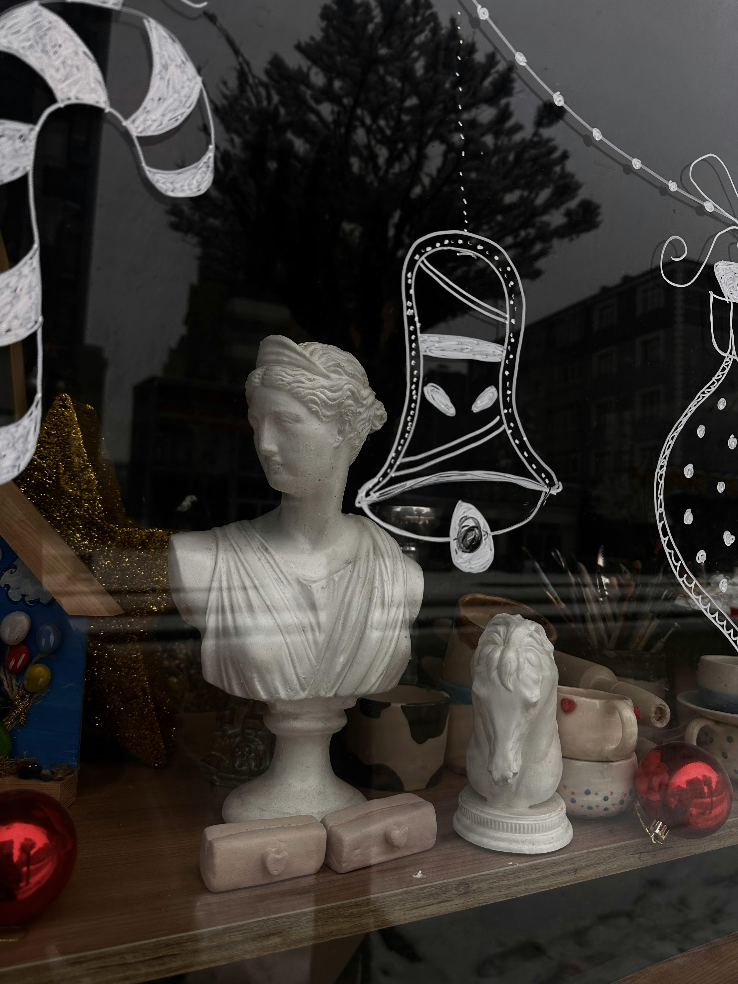 Elegant Window Display with Bust and Decorations · Free Stock Photo