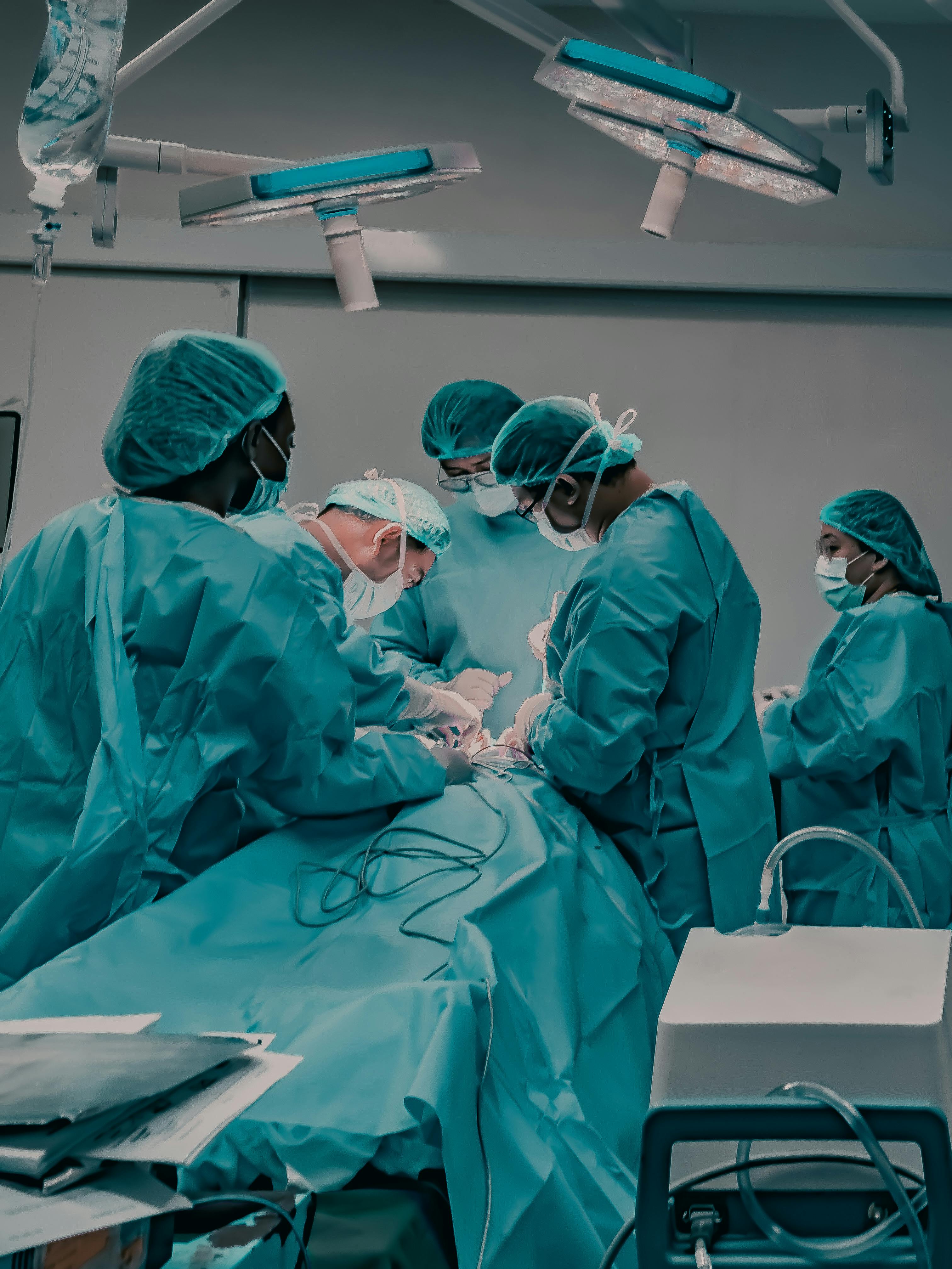 Surgical Team Performing Procedure in Operating Room · Free Stock Photo