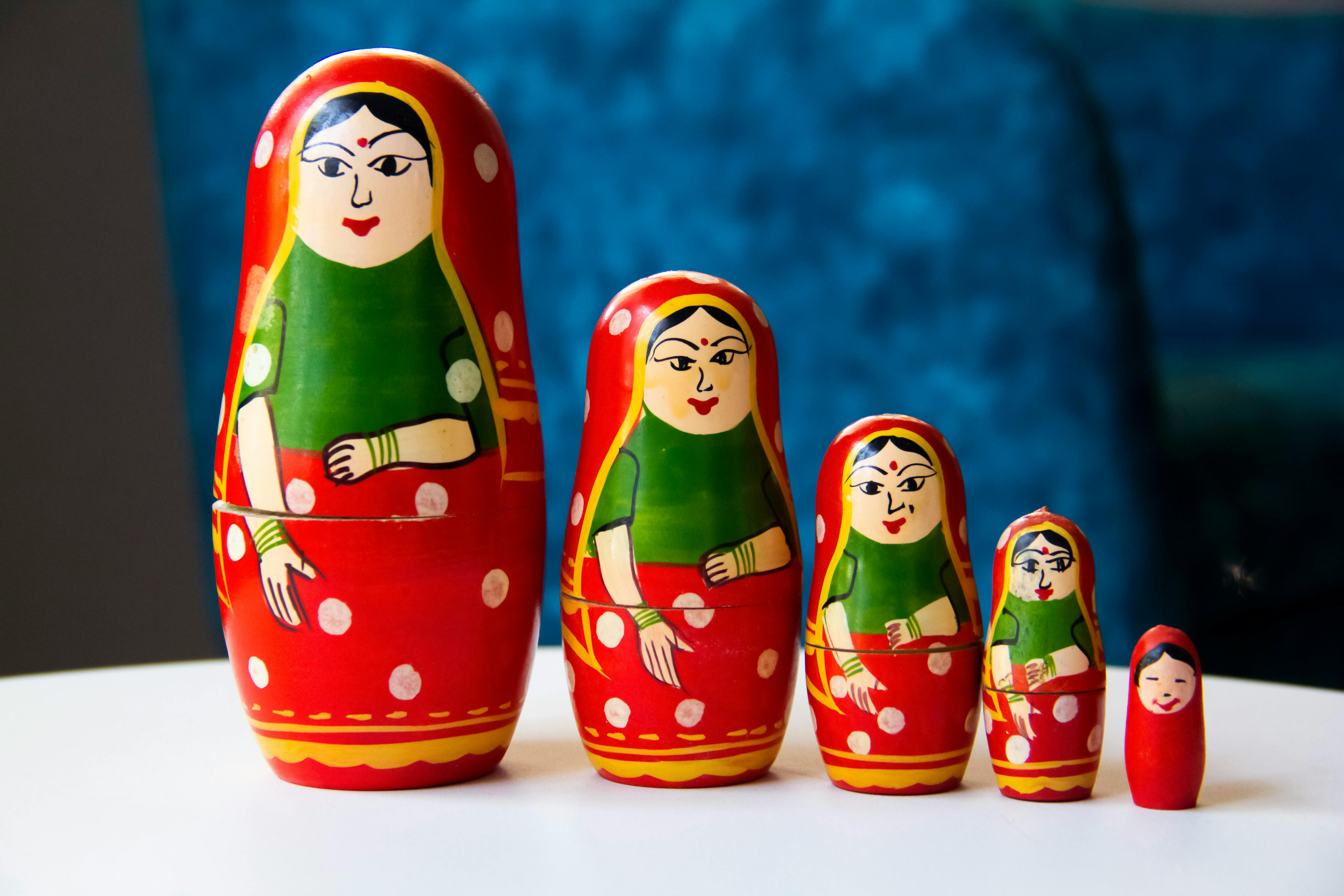 Colorful Traditional Wooden Nesting Dolls Display · Free Stock Photo