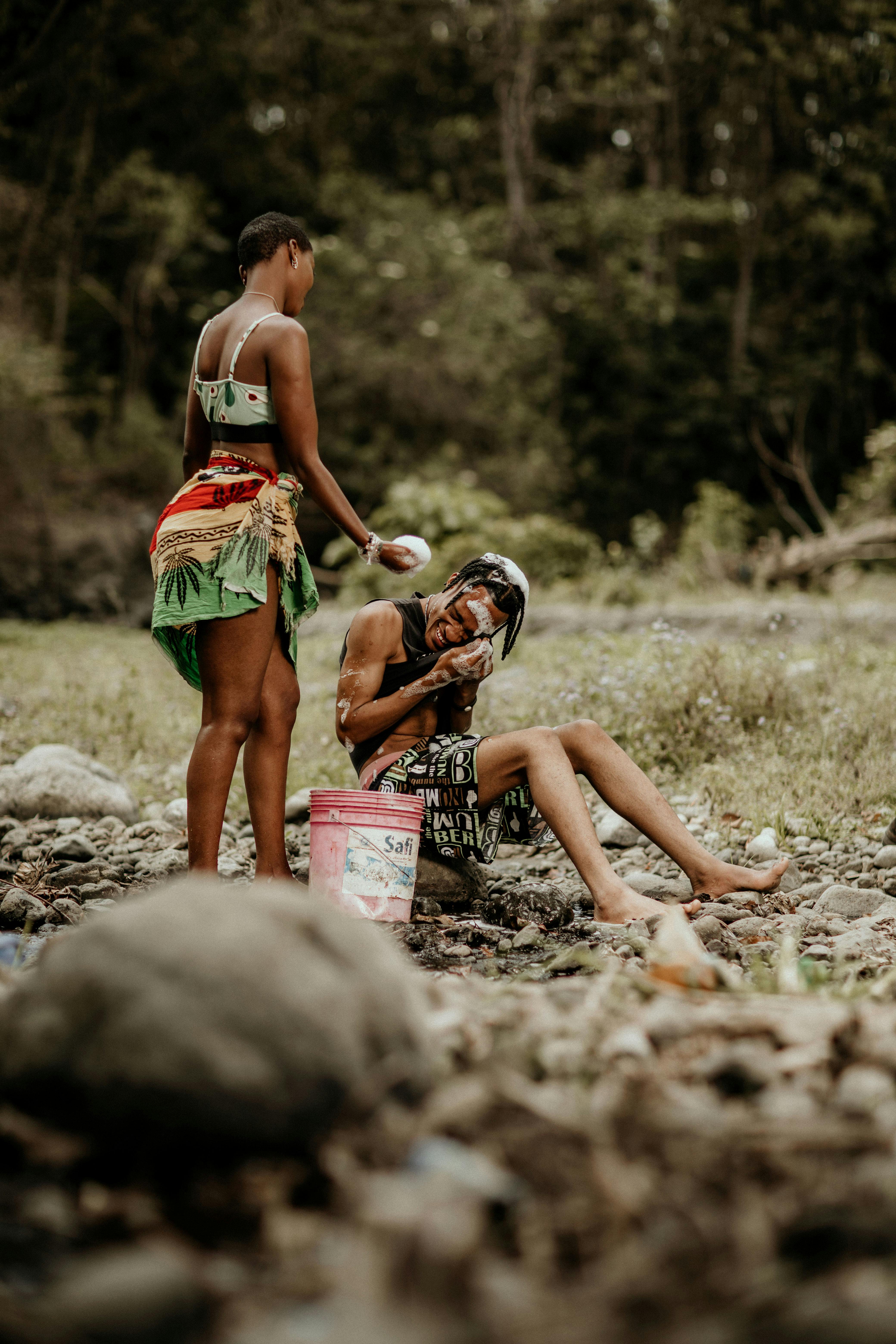 Outdoor African Cultural Bathing Scene · Free Stock Photo