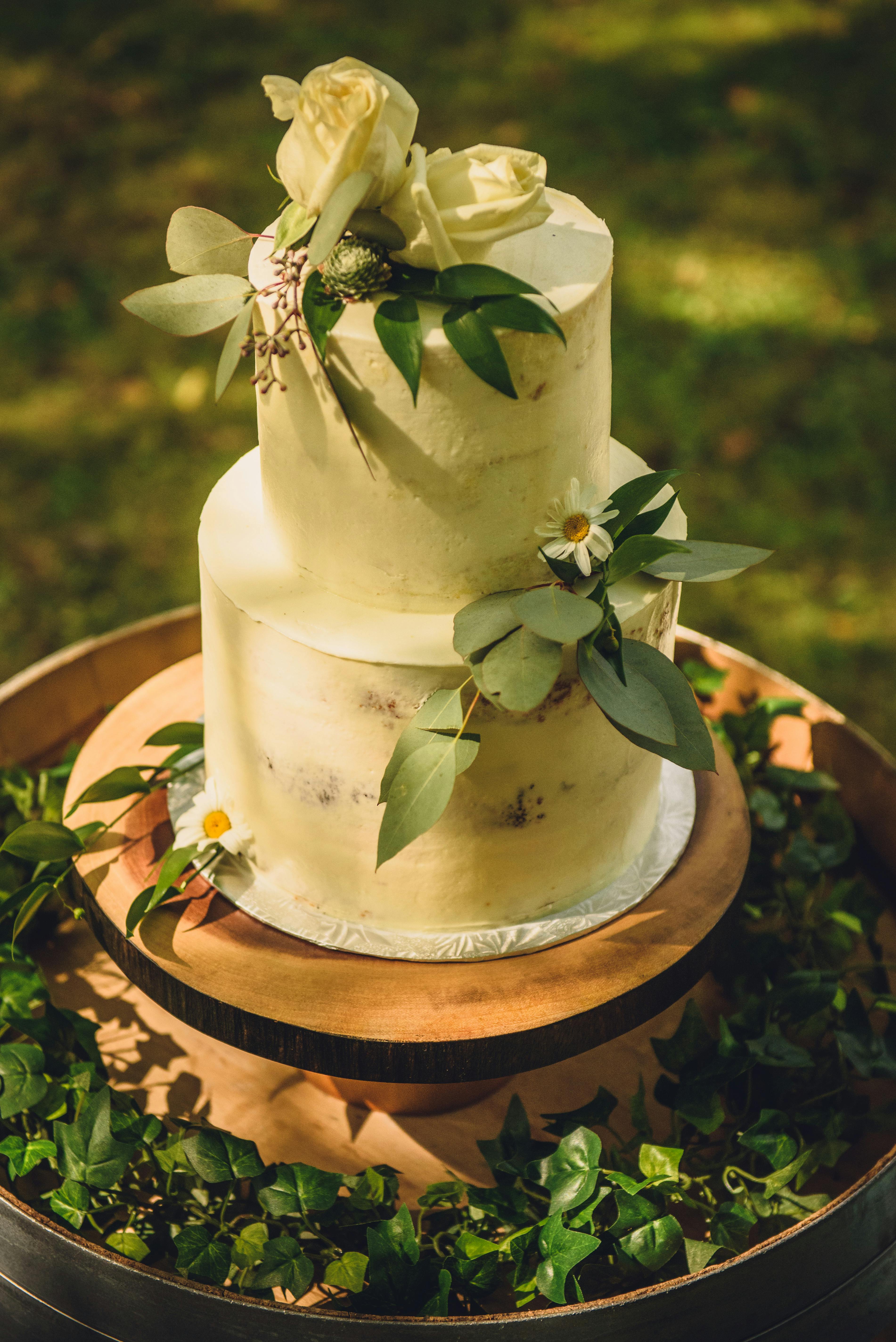 Elegant Two-Tier Wedding Cake with Floral Decor · Free Stock Photo