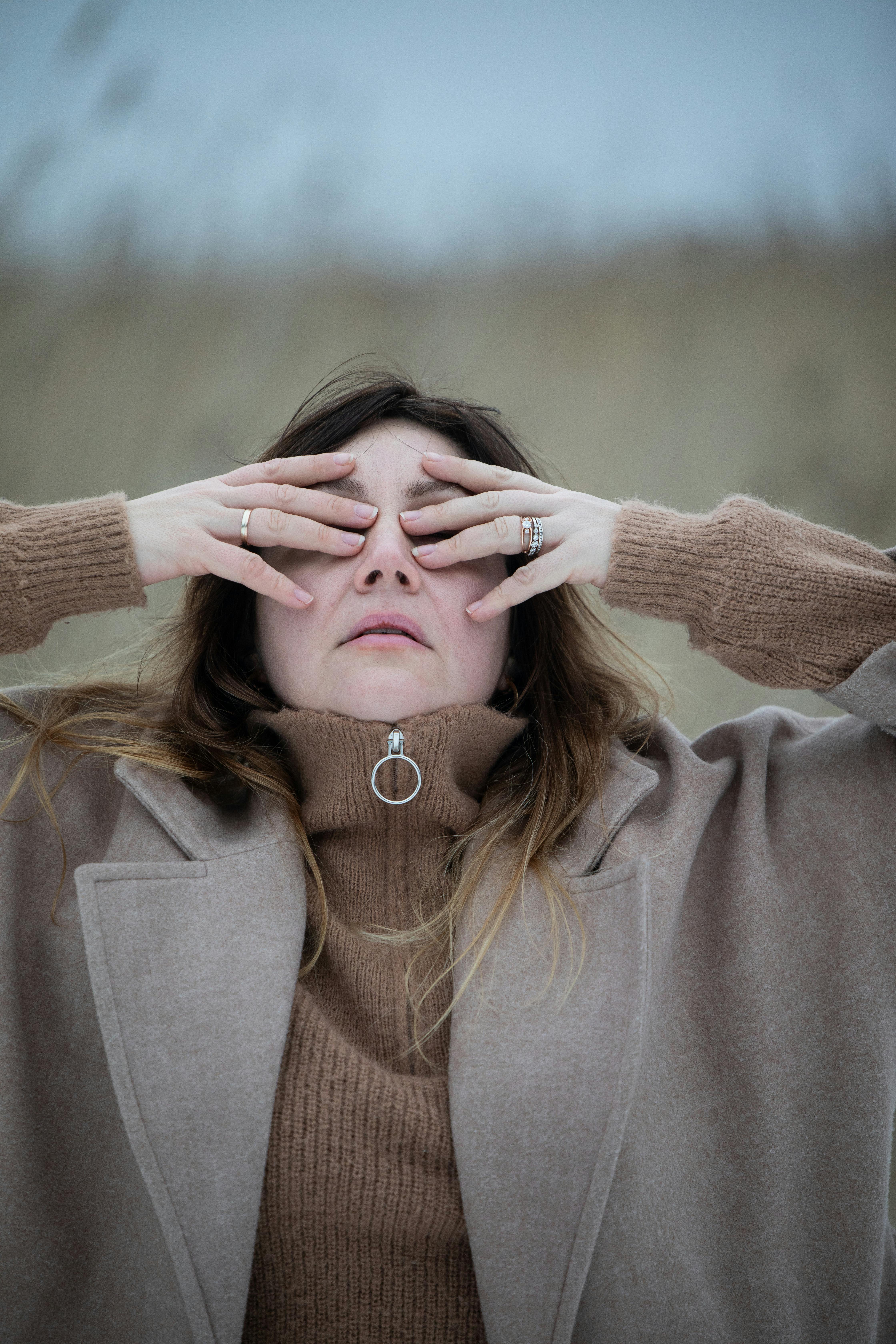 Woman in Warm Clothing Outdoors in Calm Setting · Free Stock Photo