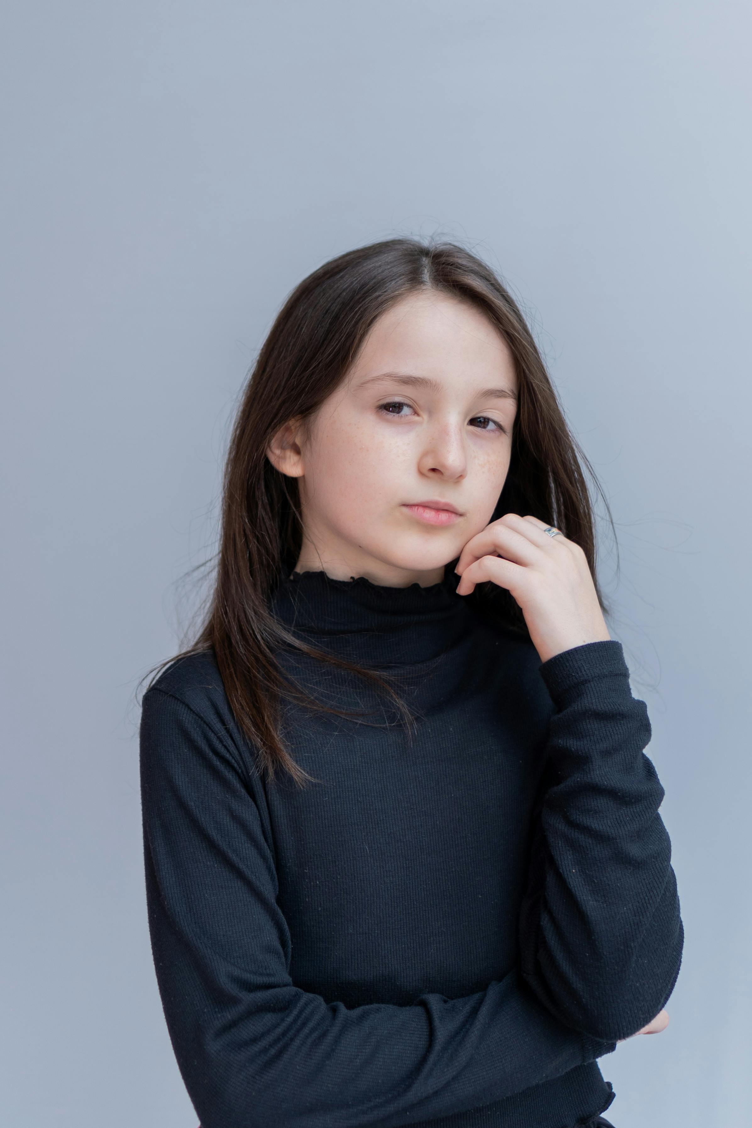 Thoughtful Teenage Girl in Black Outfit · Free Stock Photo