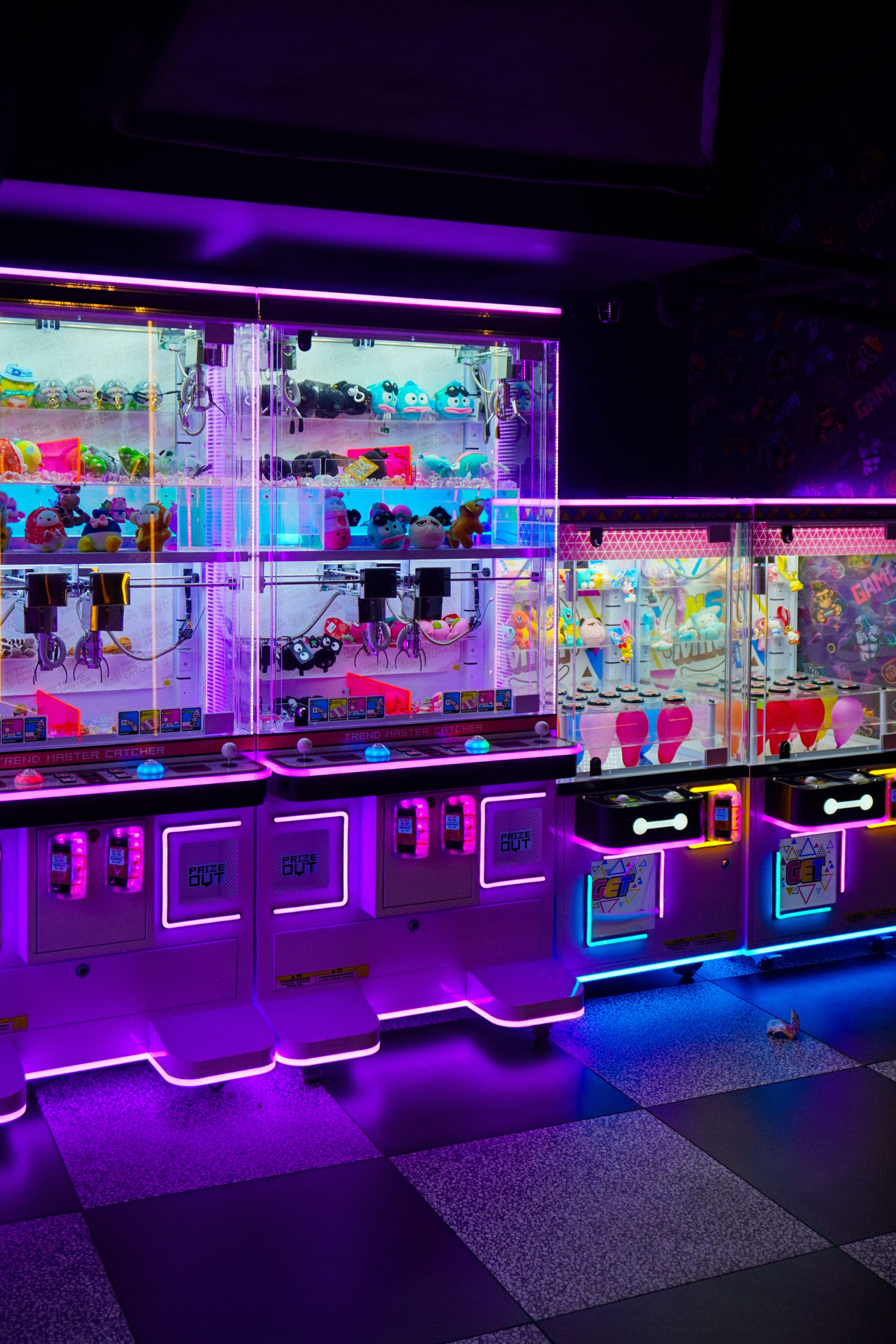 Vibrant Neon Arcade Claw Machines at Night · Free Stock Photo