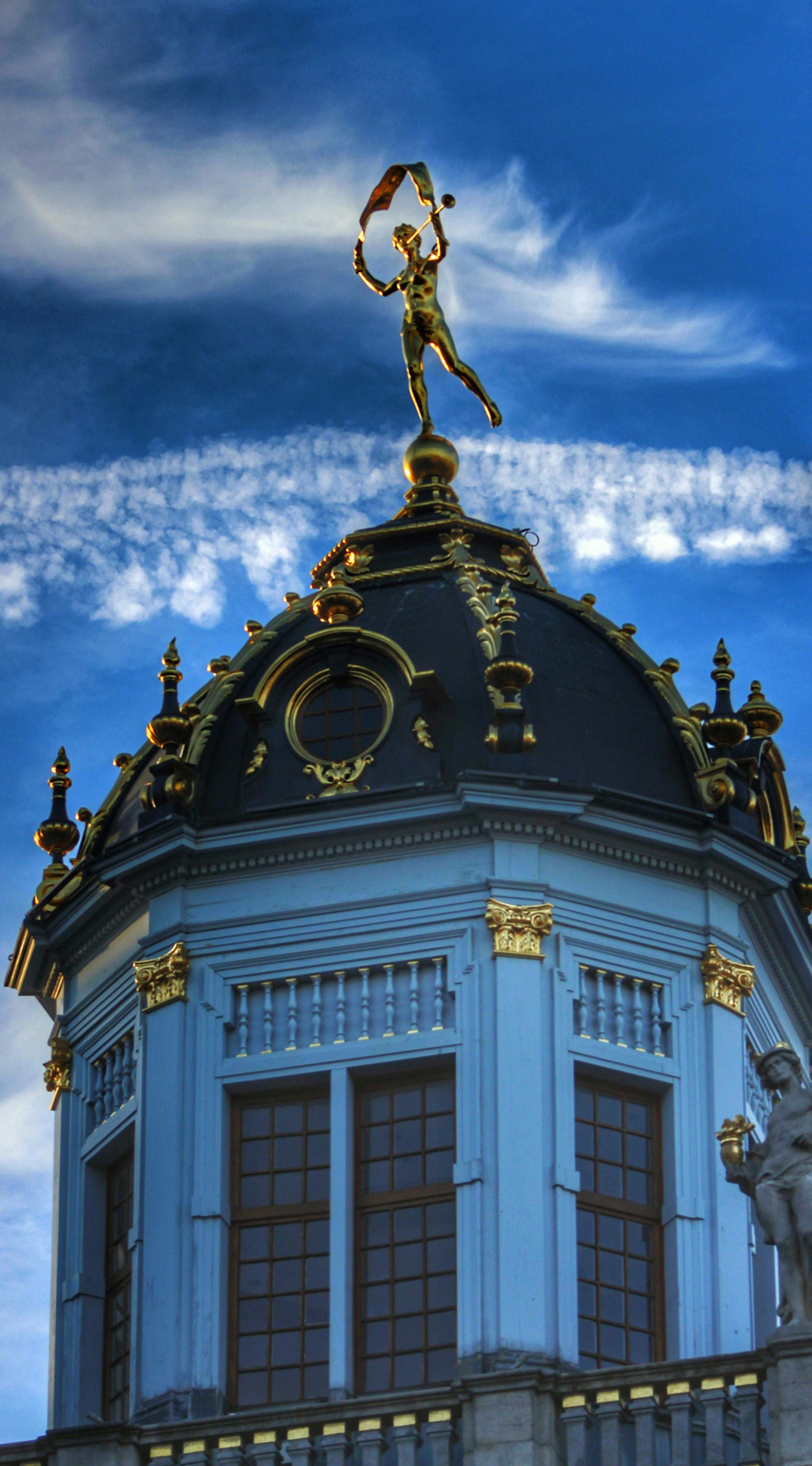 Elegant Rooftop Sculpture Against Blue Sky · Free Stock Photo