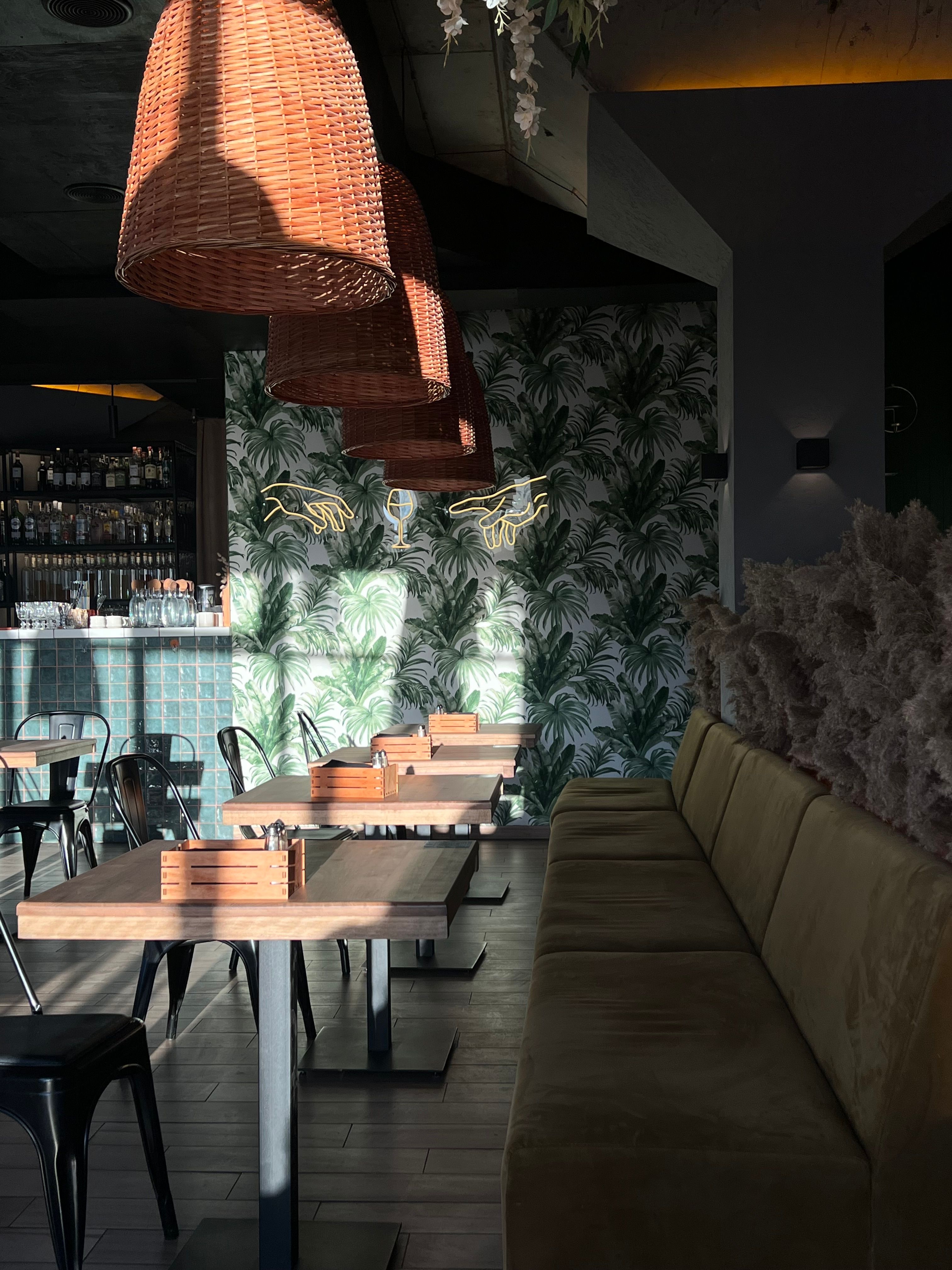 Cozy Café Interior with Wicker Lighting · Free Stock Photo