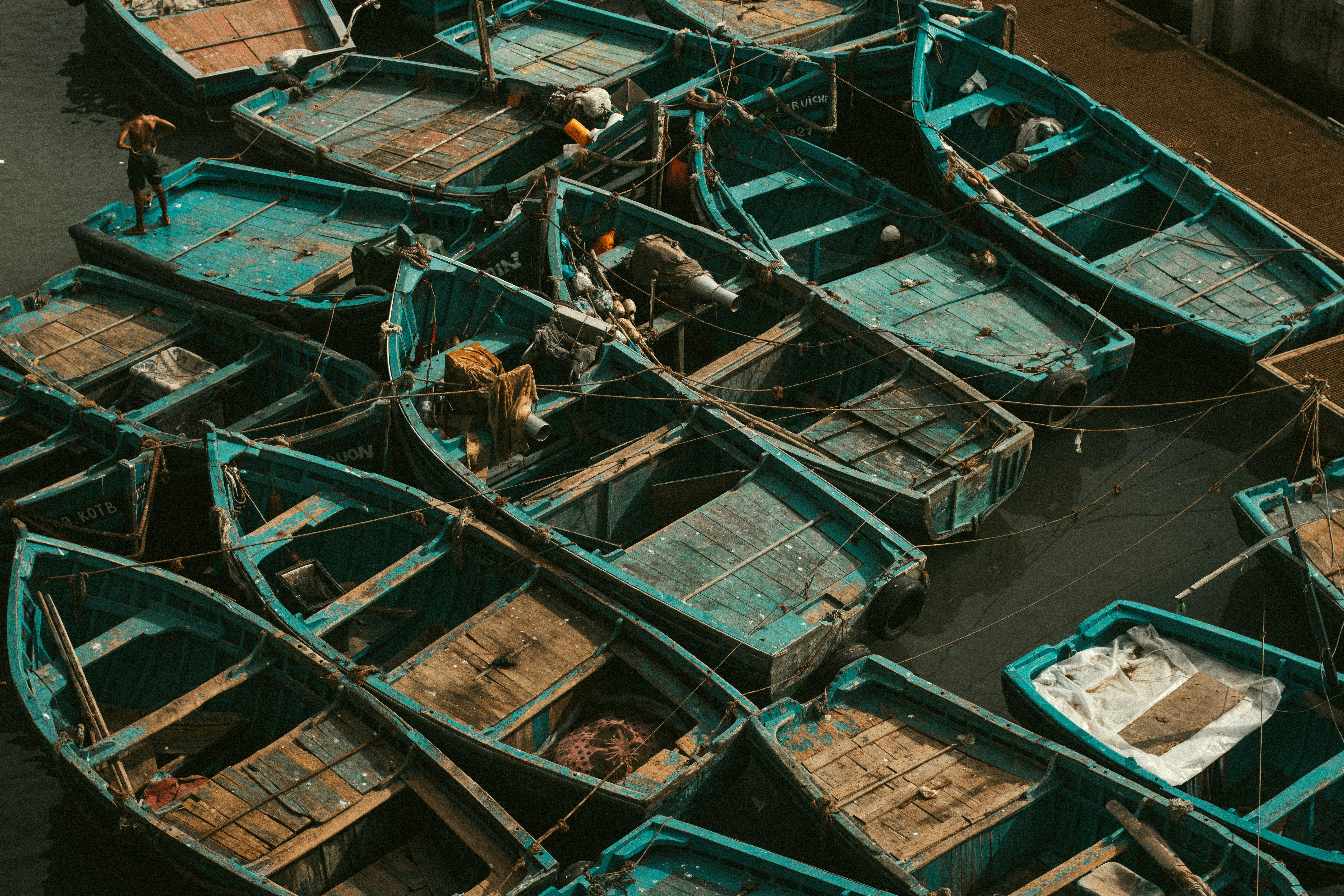 Aerial View of Rustic Cyan Fishing Boats Docked · Free Stock Photo