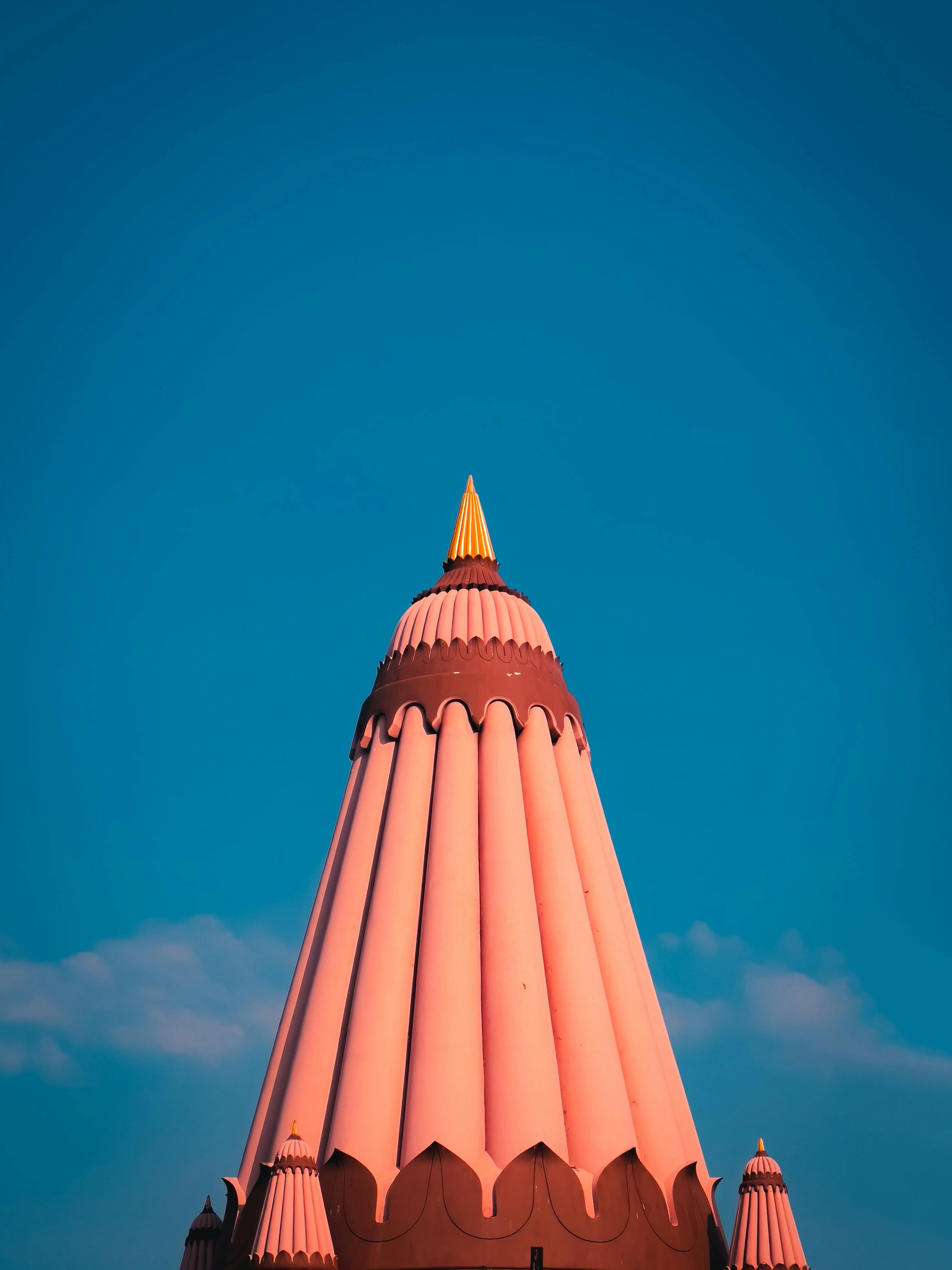 Colorful Temple Spire Against Blue Sky · Free Stock Photo
