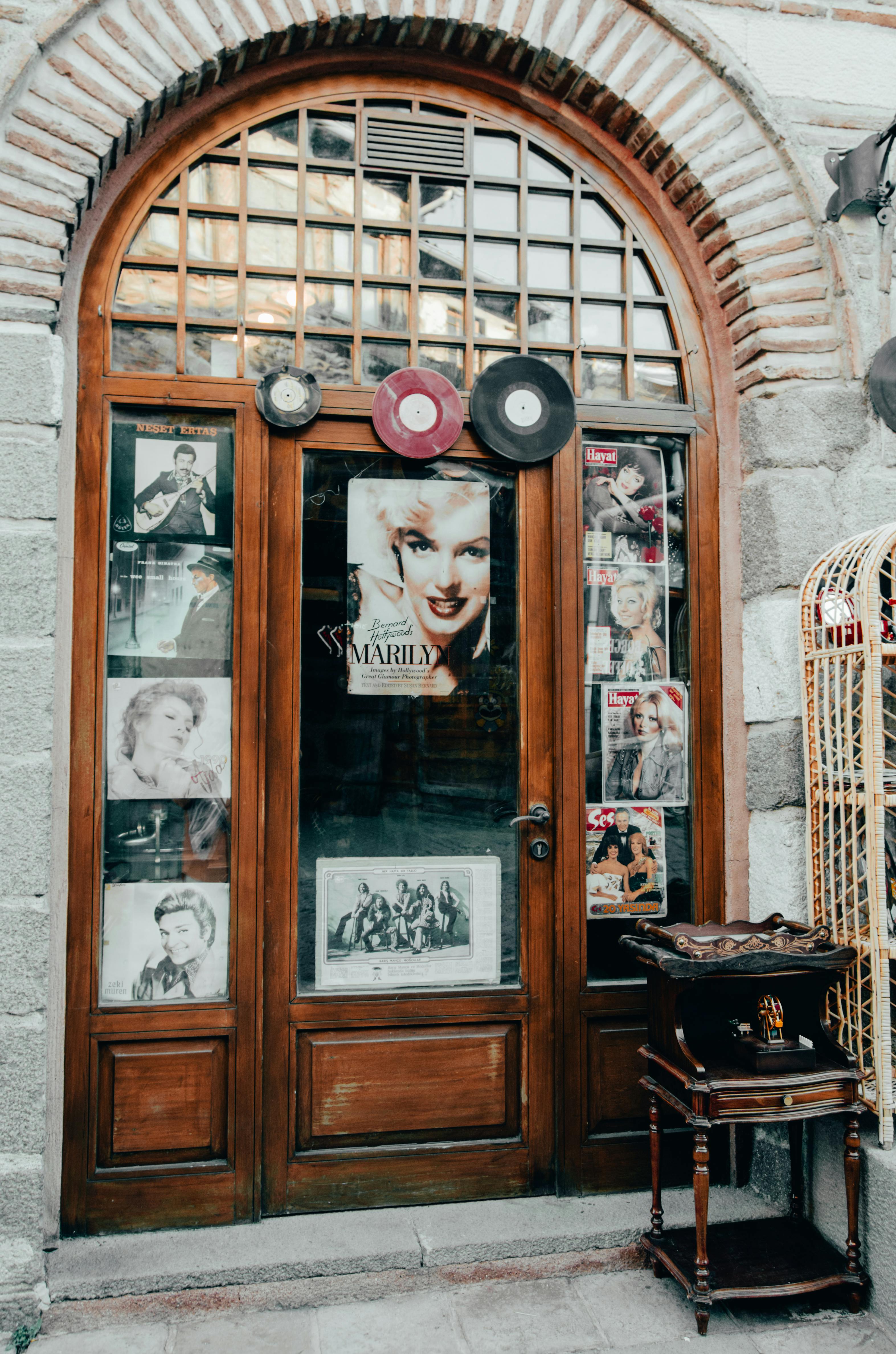 Vintage Storefront with Classic Posters and Vinyls · Free Stock Photo
