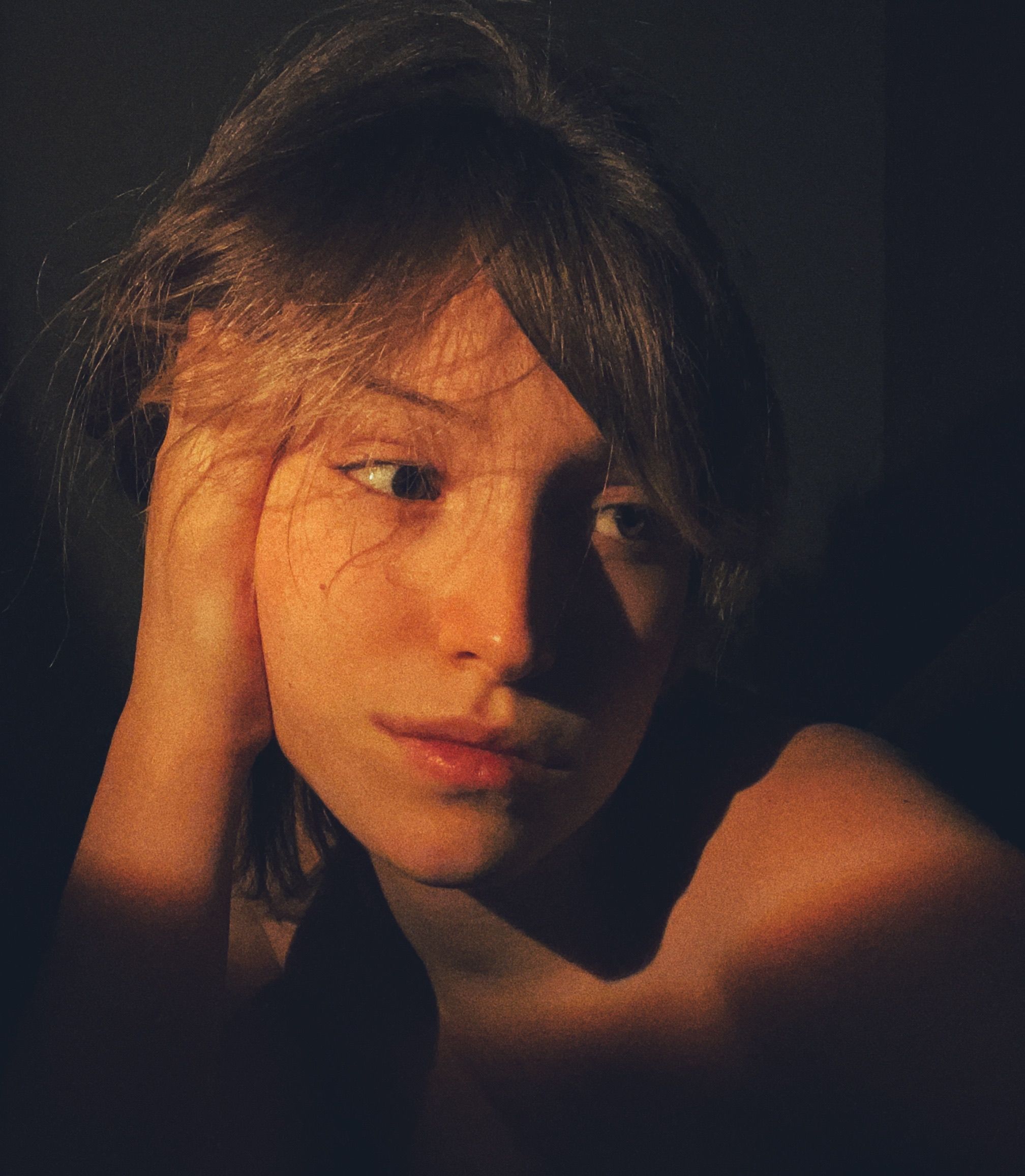 Moody Portrait of a Young Woman in Warm Light · Free Stock Photo