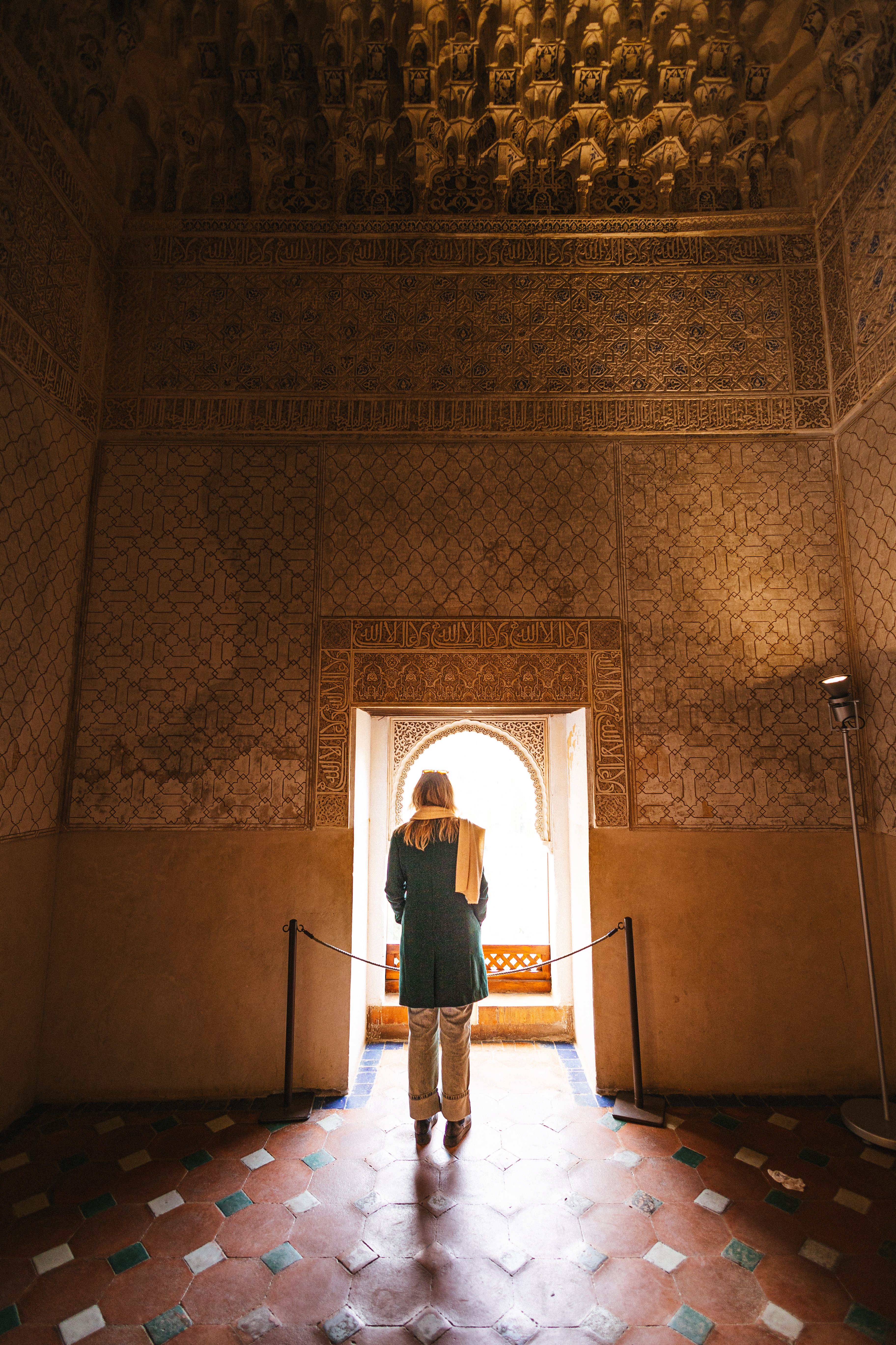 Woman Admiring Alhambra's Intricate Interior Design · Free Stock Photo