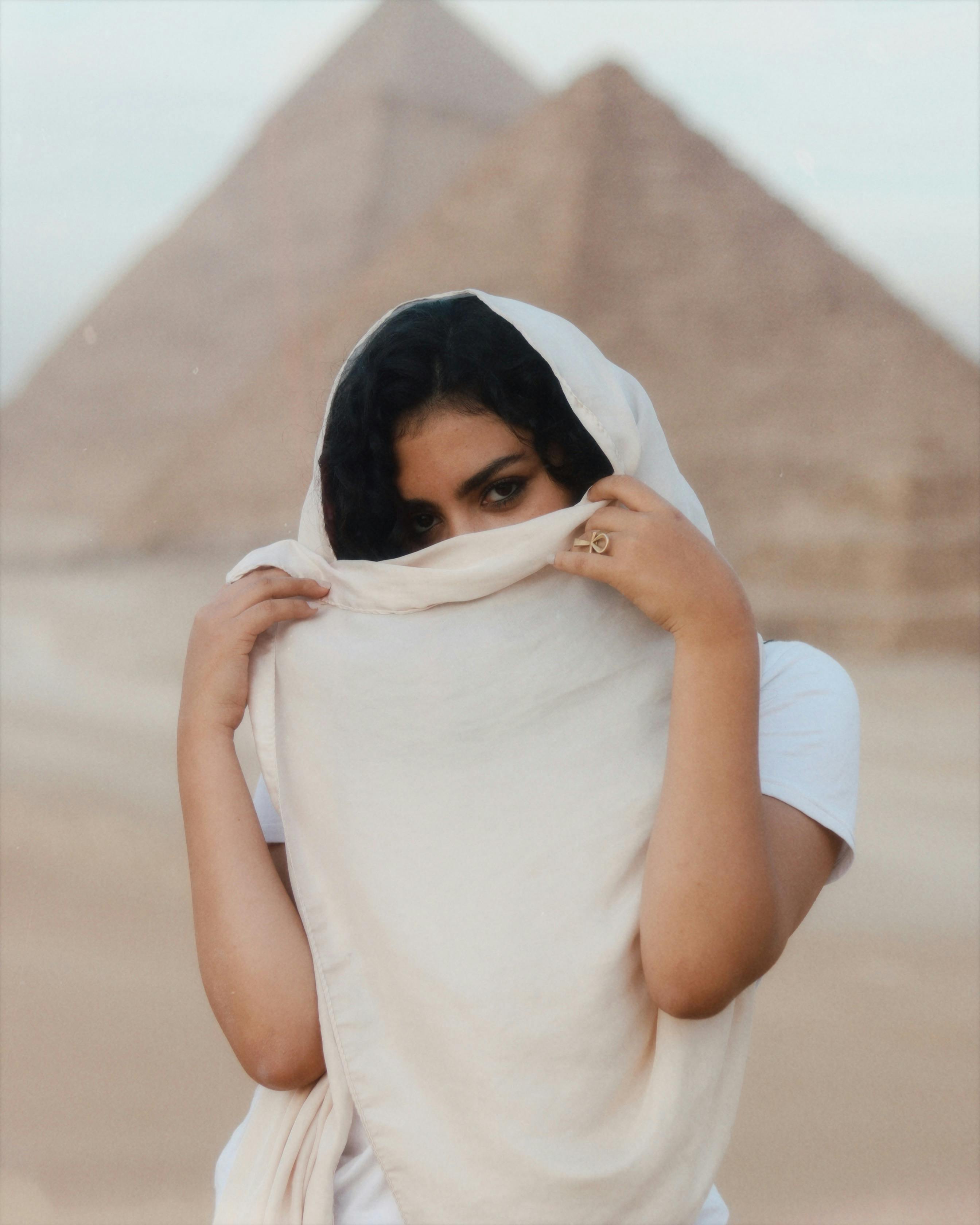 Woman Posing Near the Giza Pyramids in Egypt · Free Stock Photo