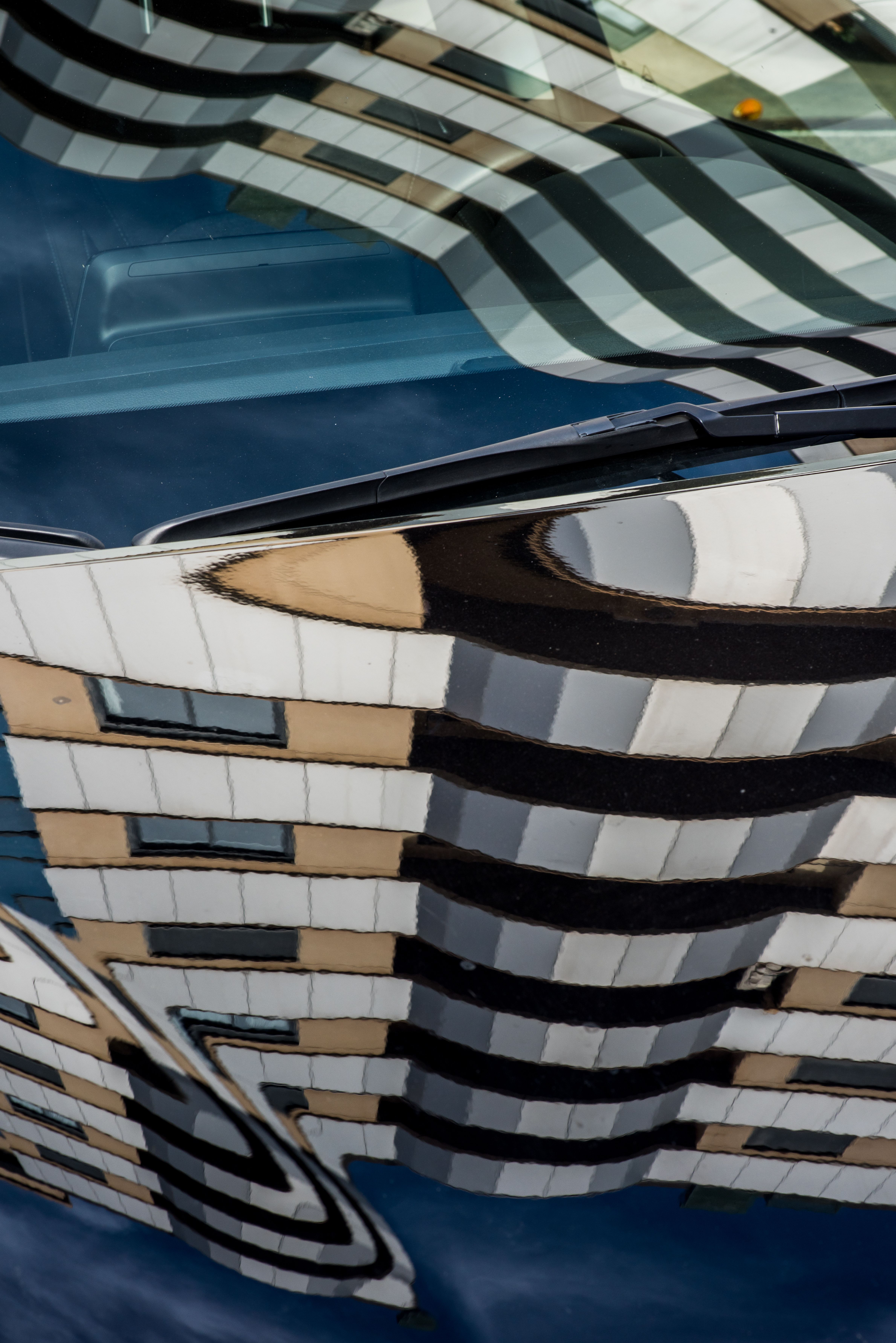 Abstract Reflection of Urban Architecture on Glass · Free Stock Photo