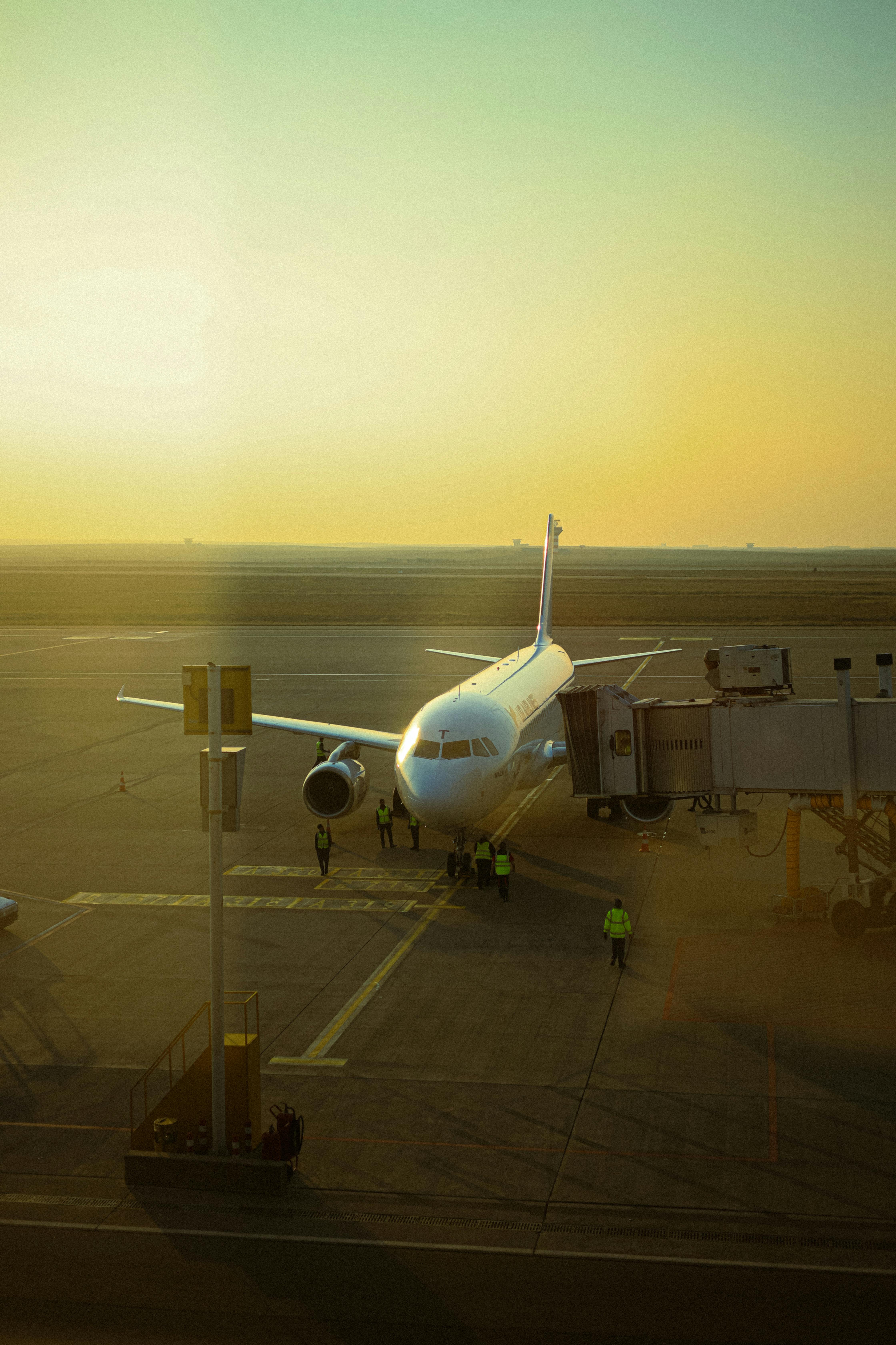 Airplane at Erbil Airport During Sunset · Free Stock Photo