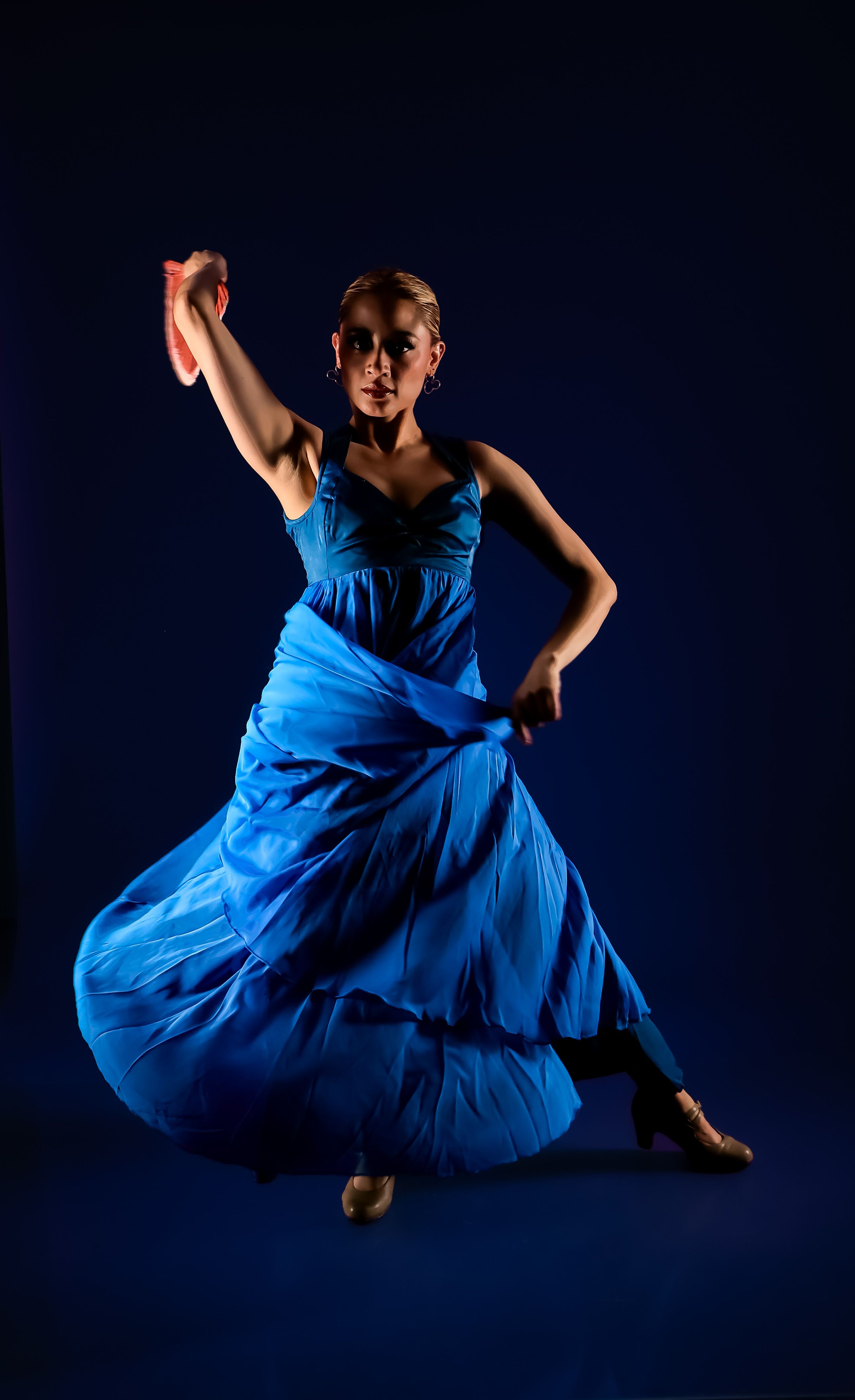 Elegant Flamenco Dancer in Flowing Blue Dress · Free Stock Photo