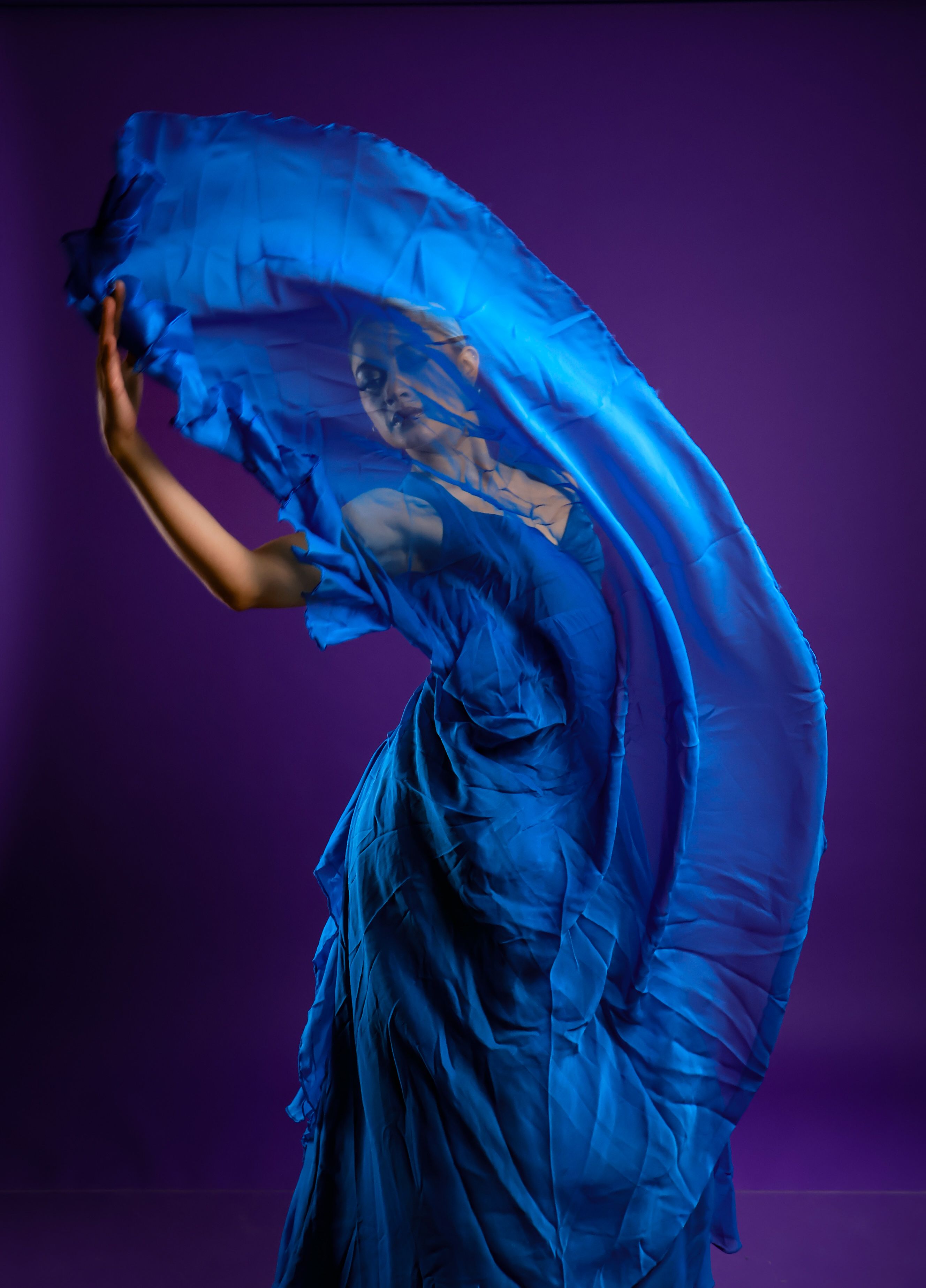 Graceful Dance in Flowing Blue Fabric · Free Stock Photo