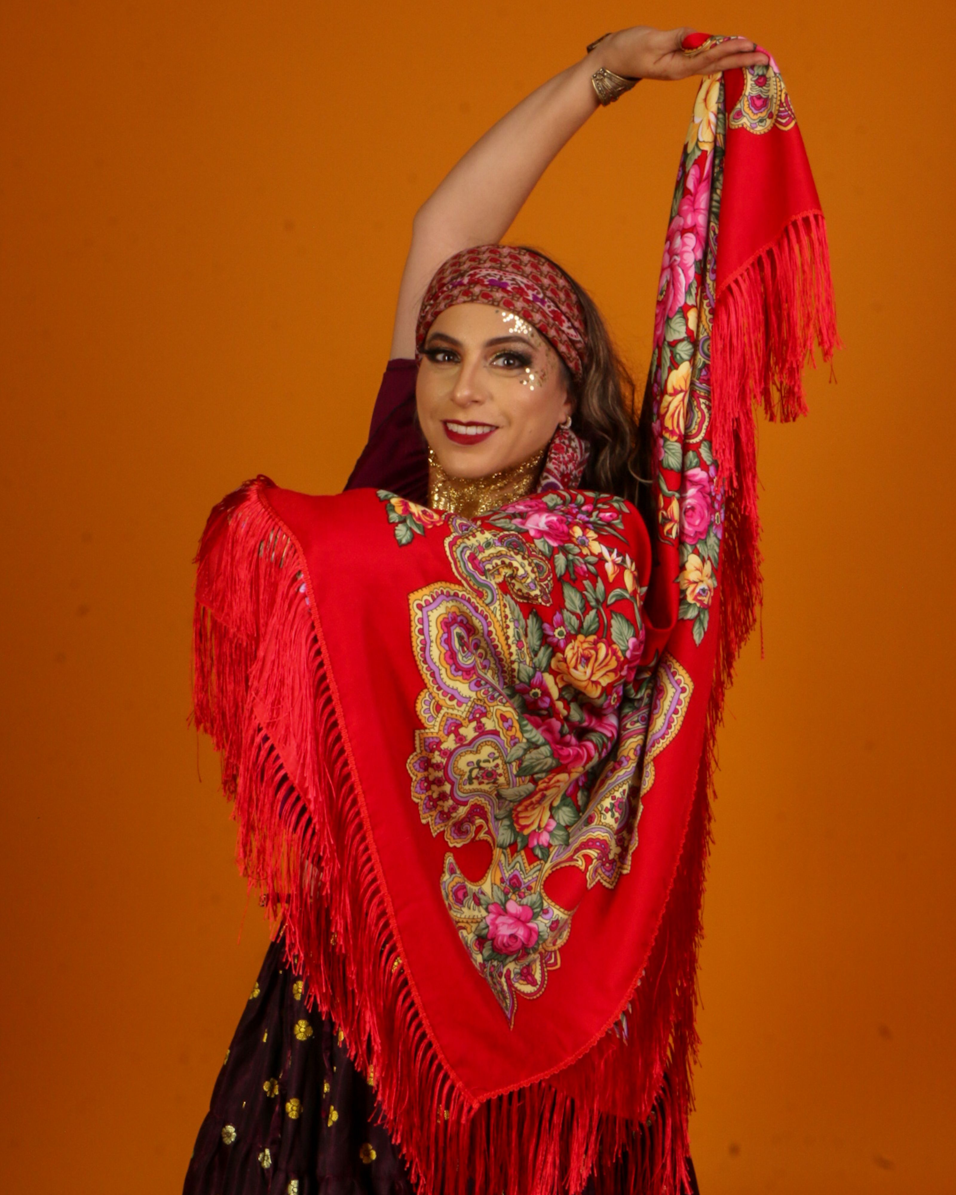 Vibrant Belly Dancer Holding Colorful Red Scarf · Free Stock Photo