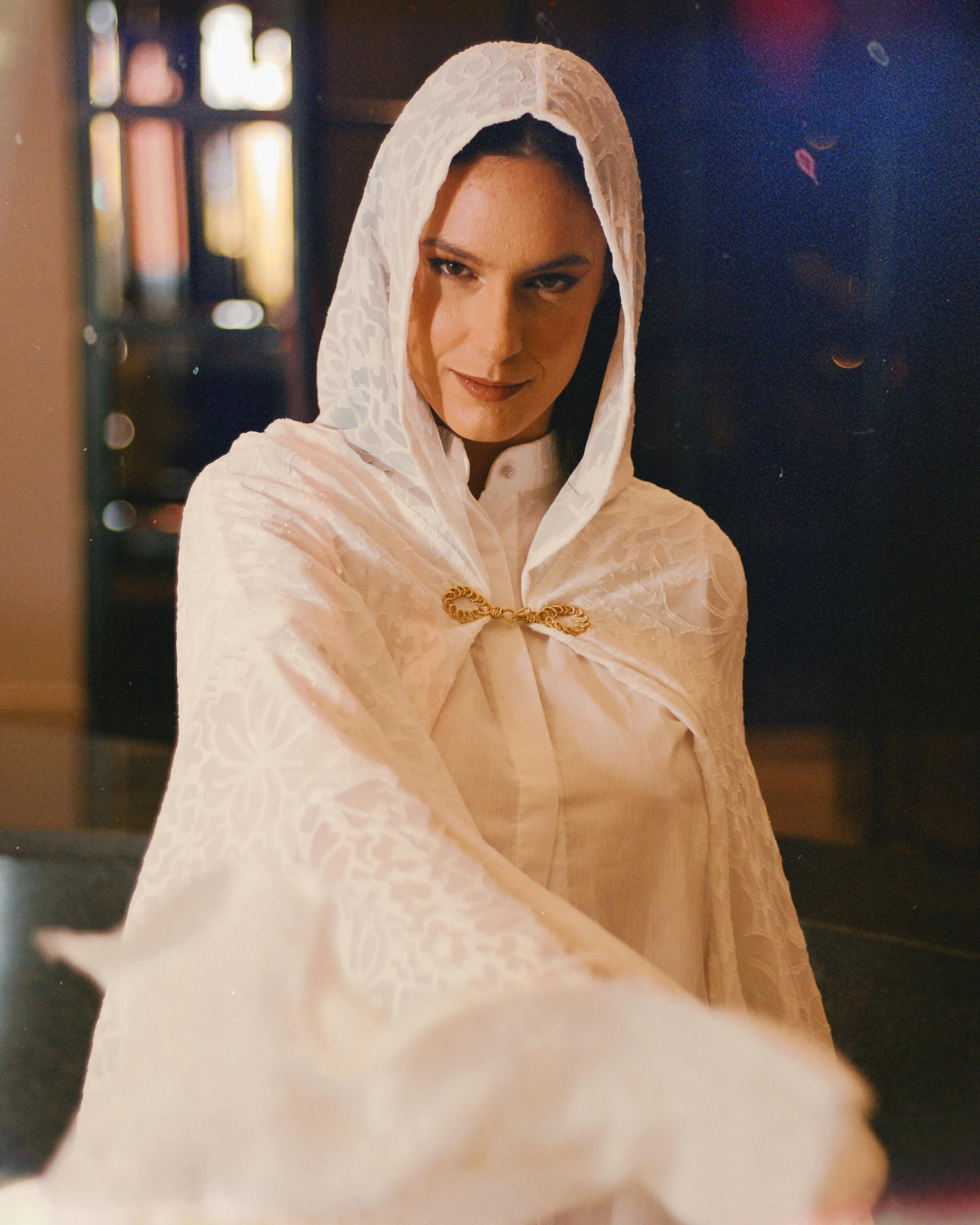 Elegant Woman in Traditional Moroccan Cloak · Free Stock Photo