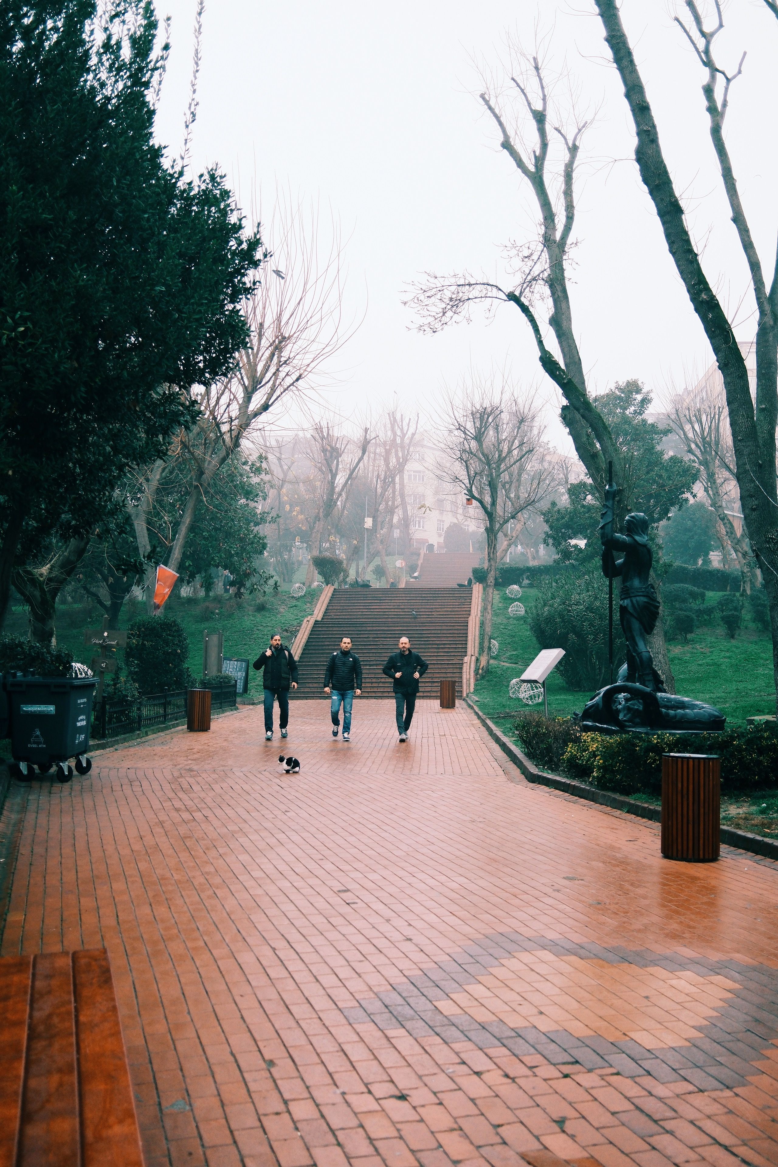 Morning Walk in Misty Park with Statues · Free Stock Photo