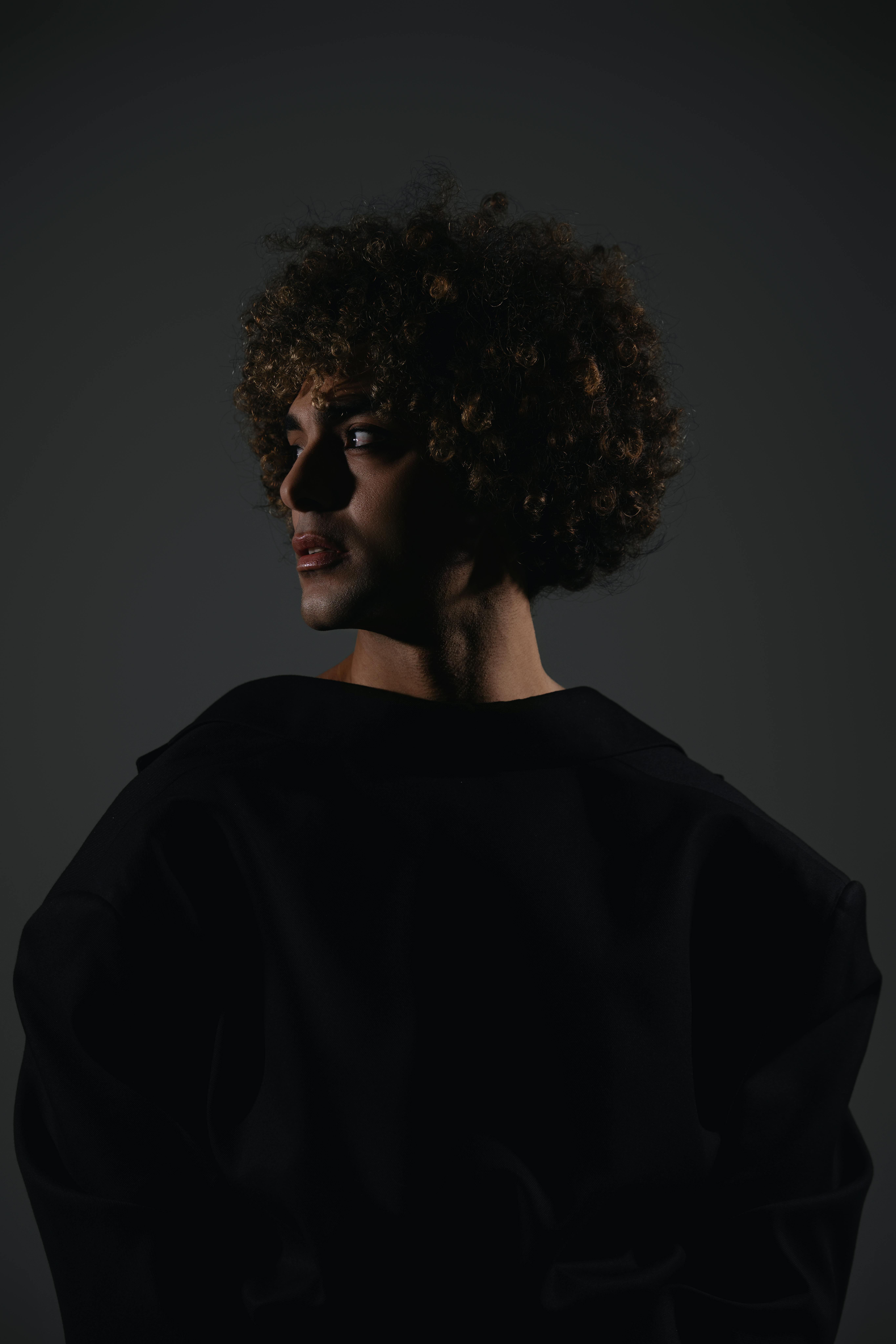 Dramatic Low-Key Fashion Portrait in London Studio · Free Stock Photo