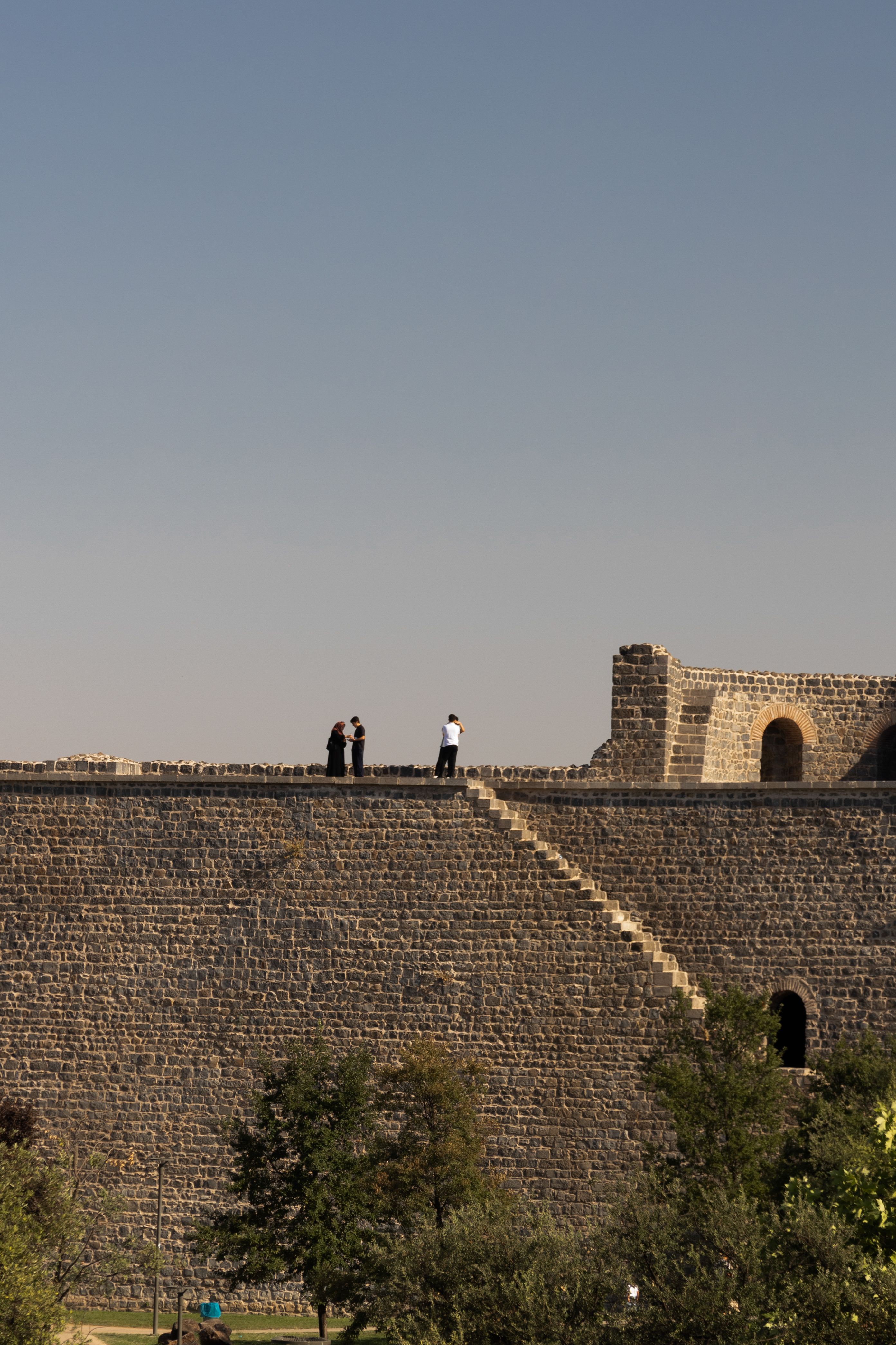 Historic Stone Fort with People Walking · Free Stock Photo