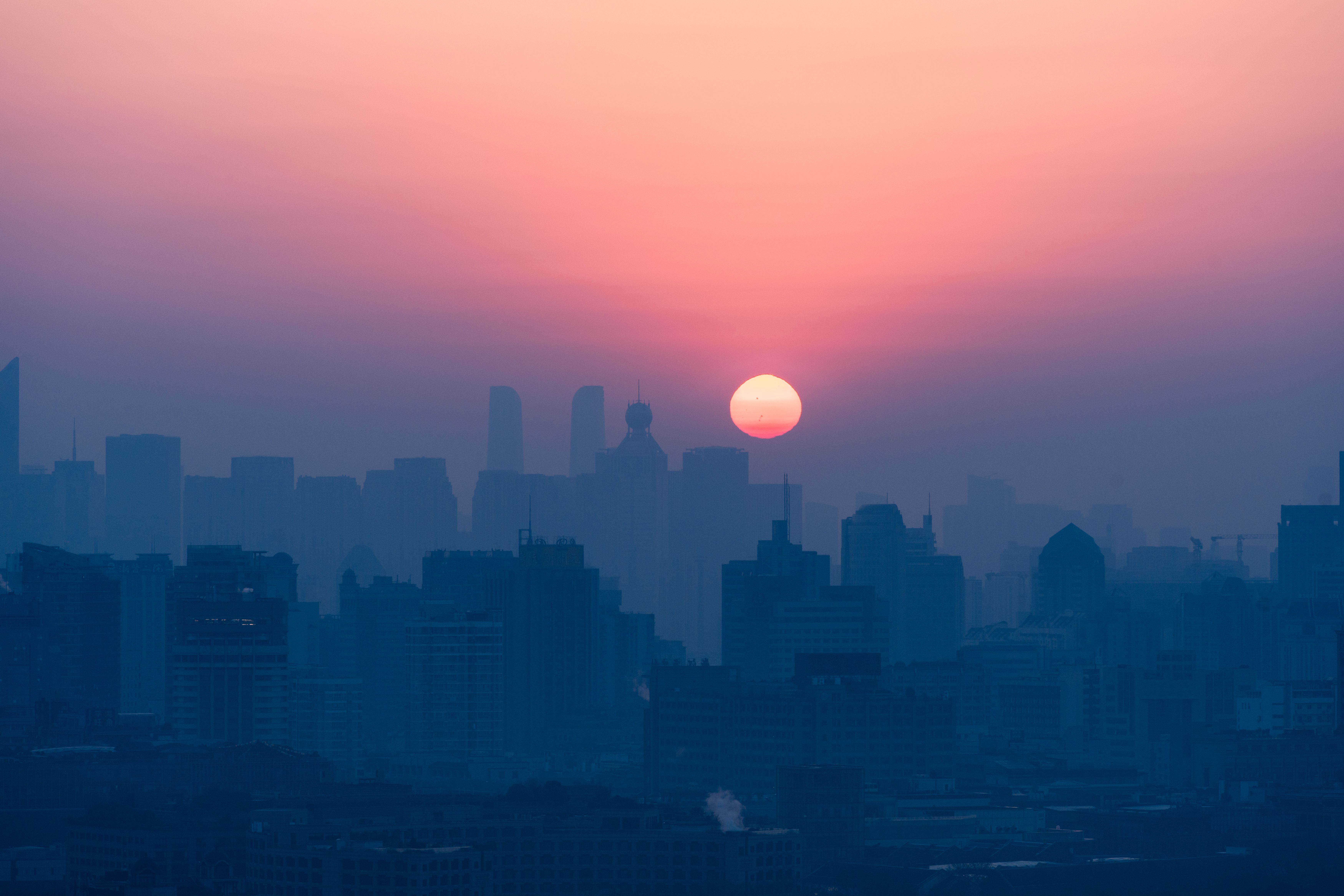 Dramatic Sunset Over City Skyline · Free Stock Photo