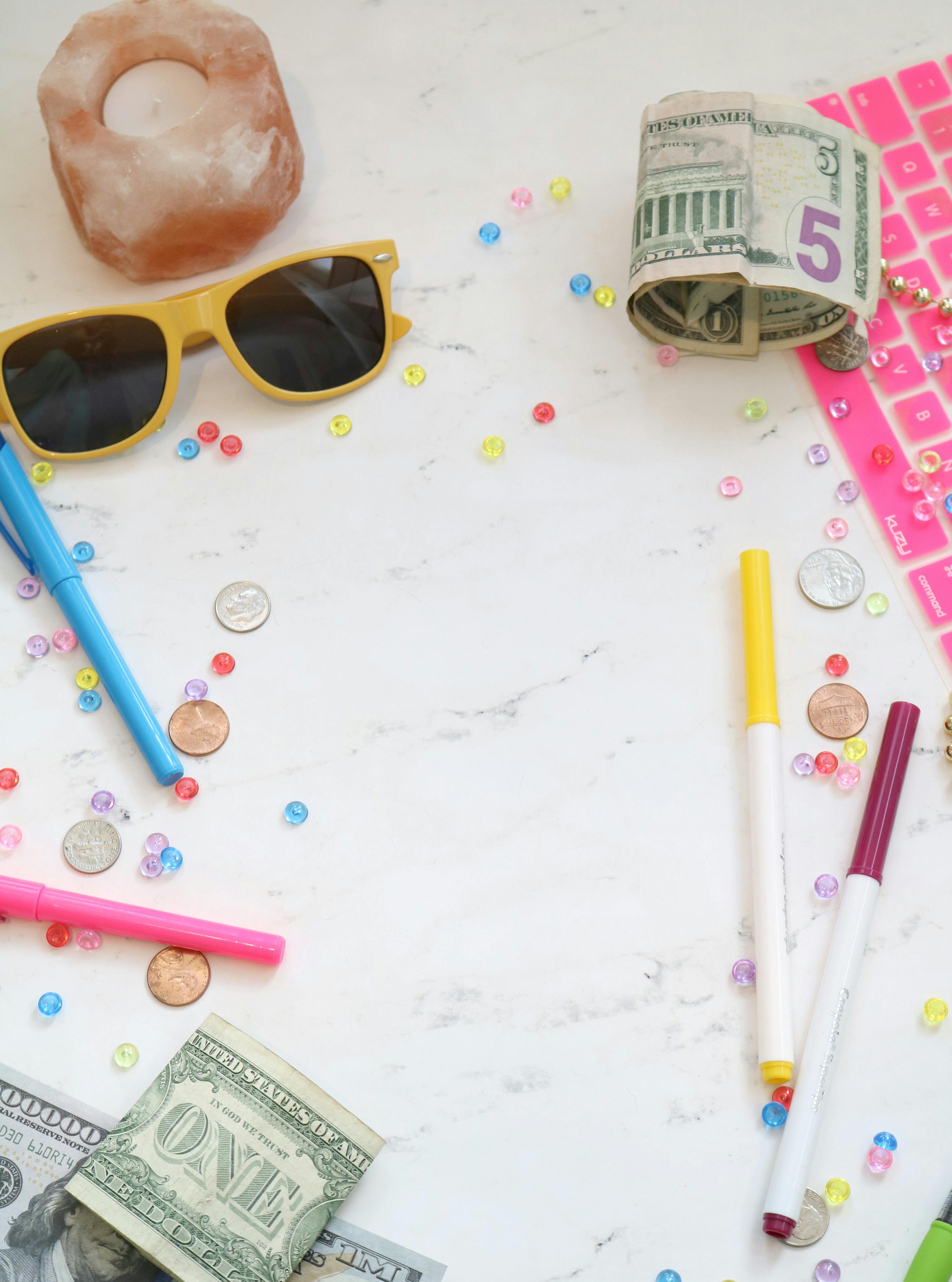 Sunglasses, Dollar Bills, Coins and Pens on White Surface · Free Stock ...