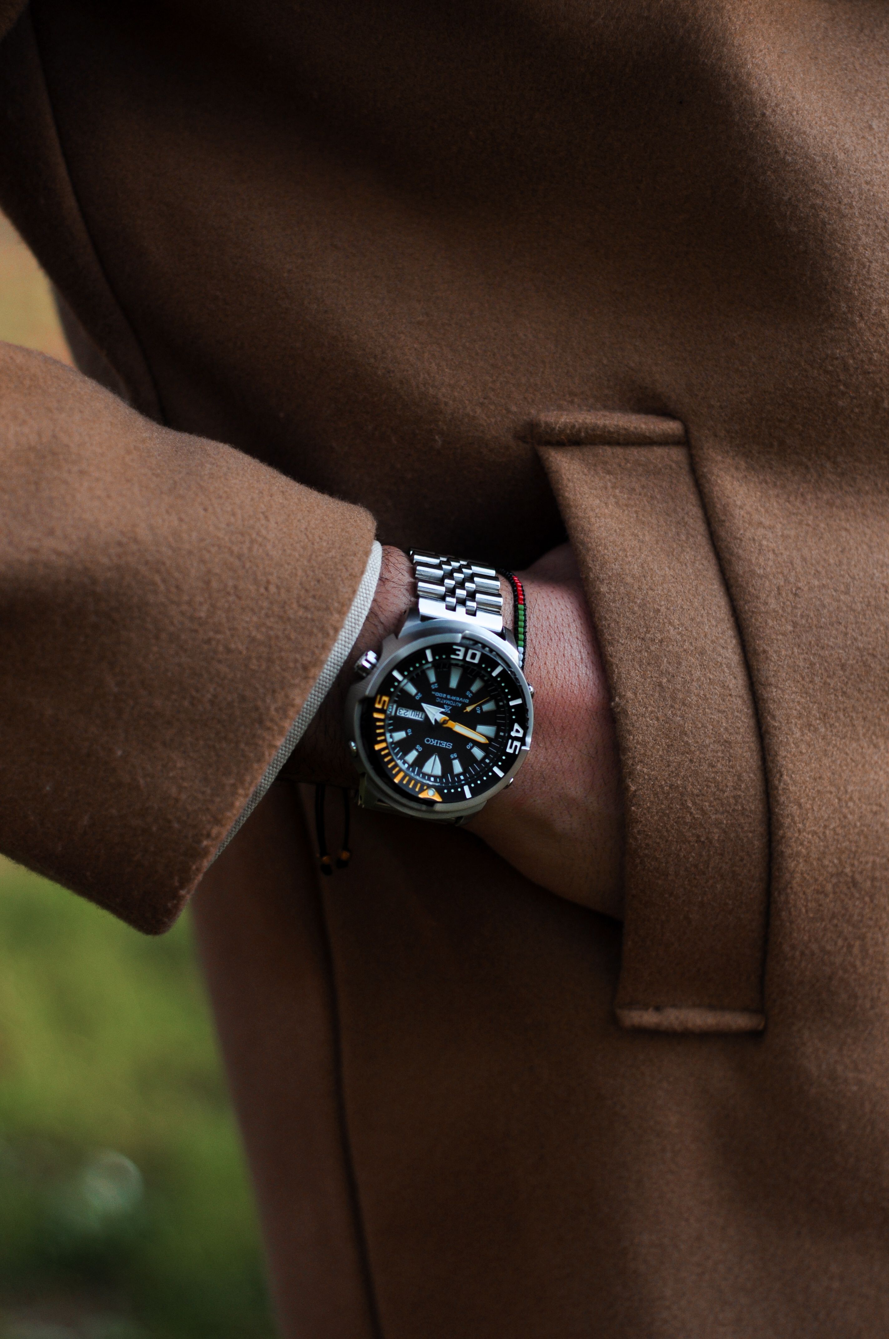 Elegant Men's Watch and Brown Coat Close-Up · Free Stock Photo