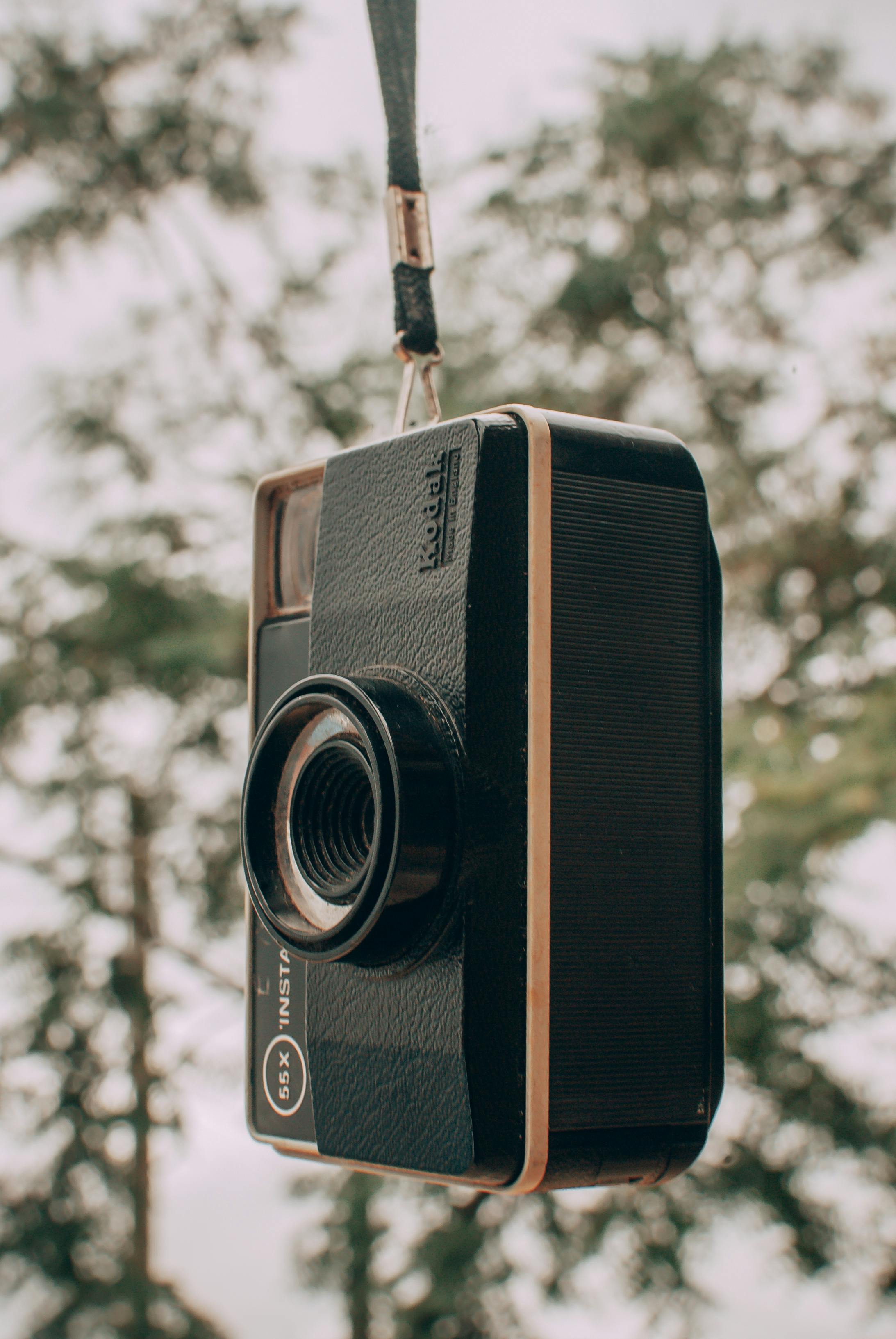 Vintage Camera Hanging with Nature Background · Free Stock Photo