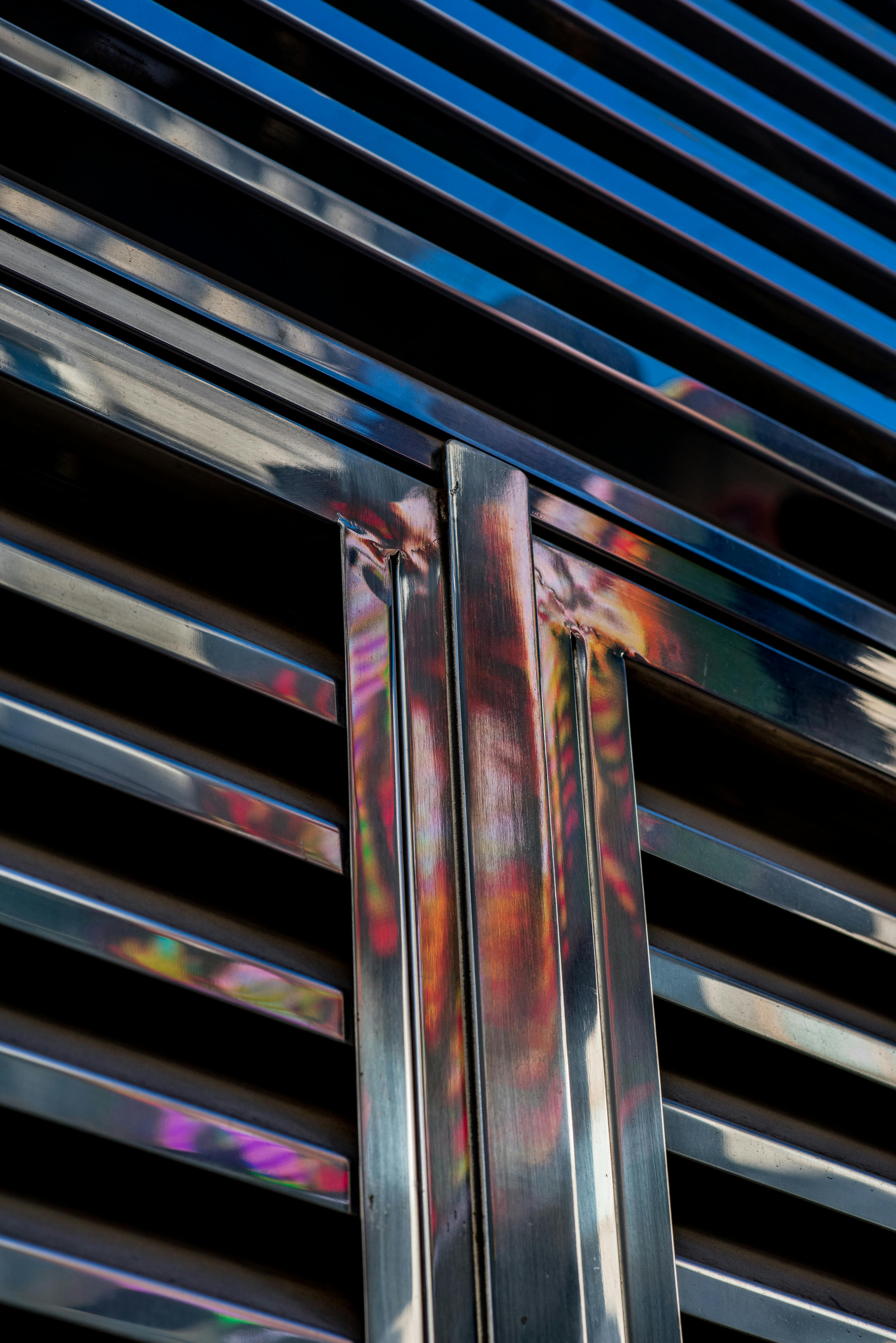 Abstract Reflection on Metallic Surface Panels · Free Stock Photo