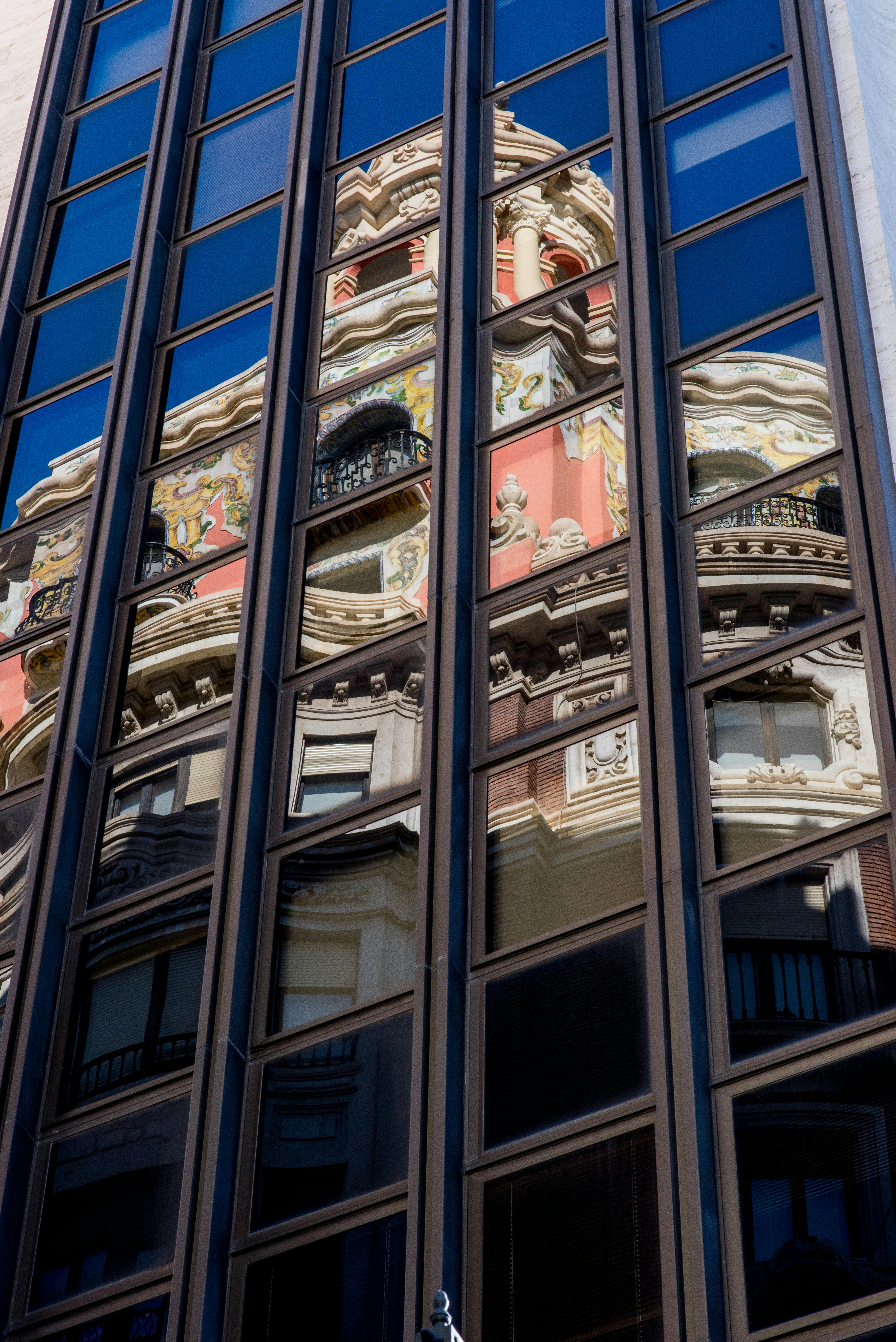 Architectural Reflection in Urban Glass Facade · Free Stock Photo