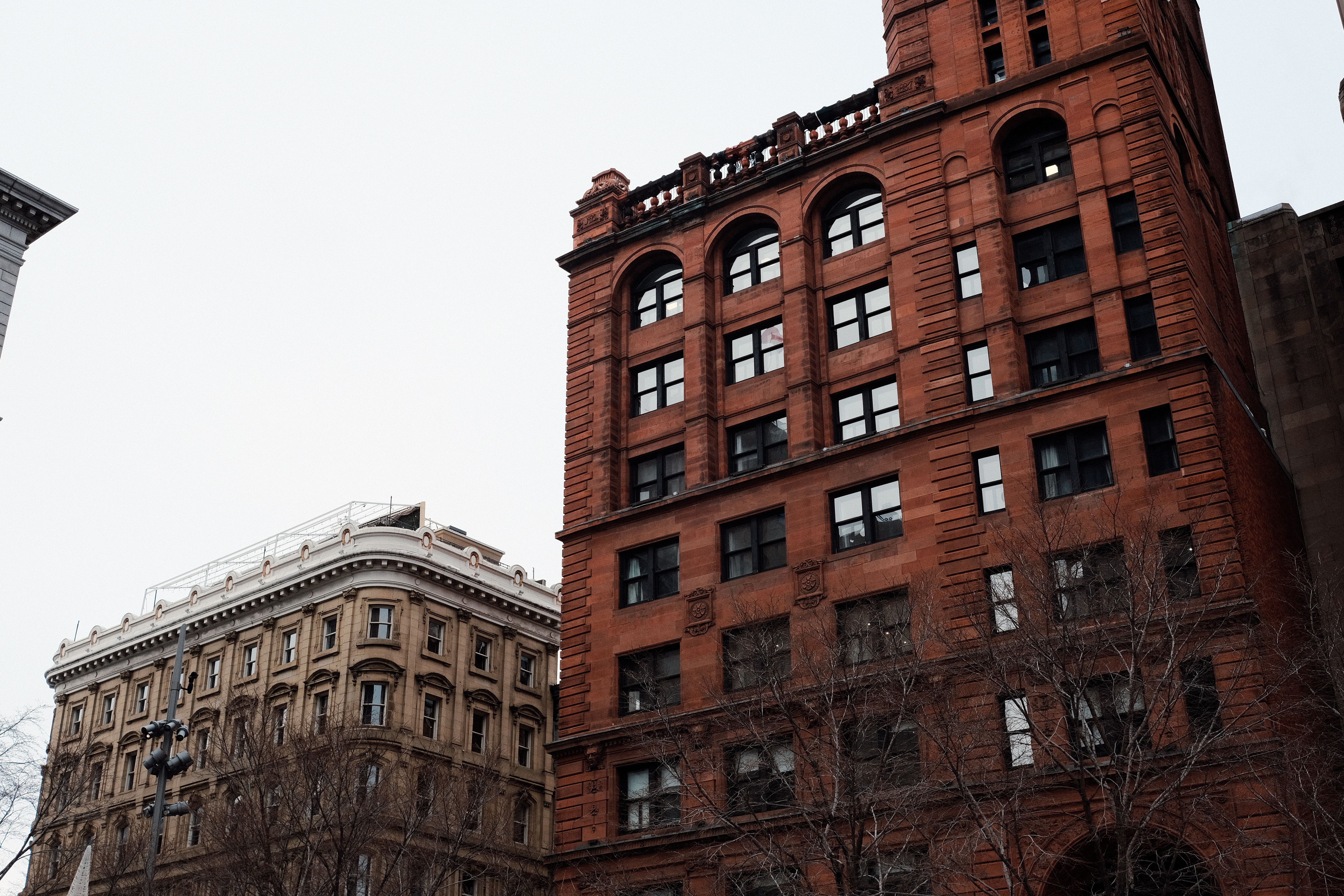 Historic Red Brick and Stone Building in Urban Setting · Free Stock Photo