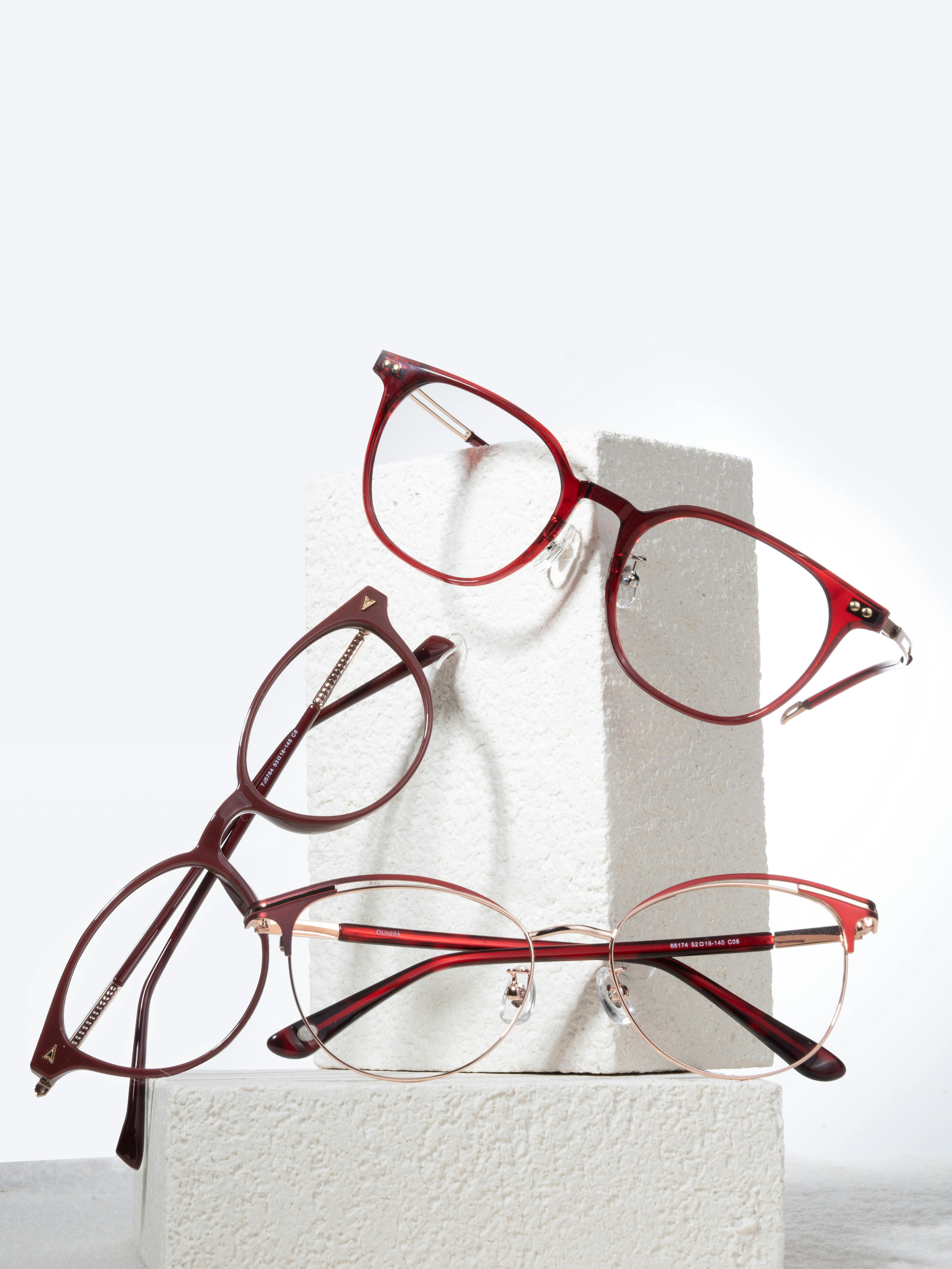 Elegant Designer Eyeglasses Display on Minimalist Blocks · Free Stock Photo