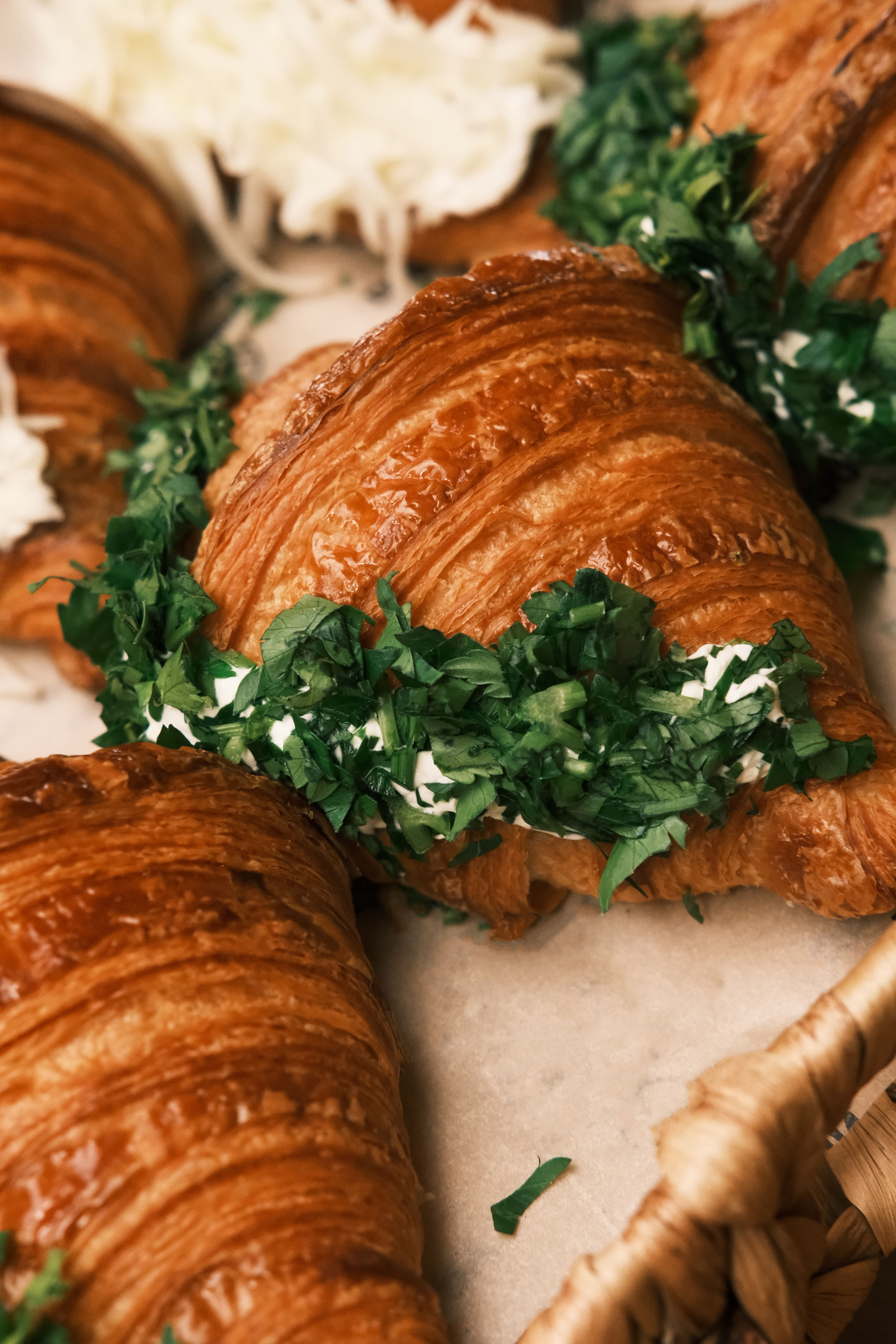 Delicious Flaky Croissant with Fresh Herbs · Free Stock Photo
