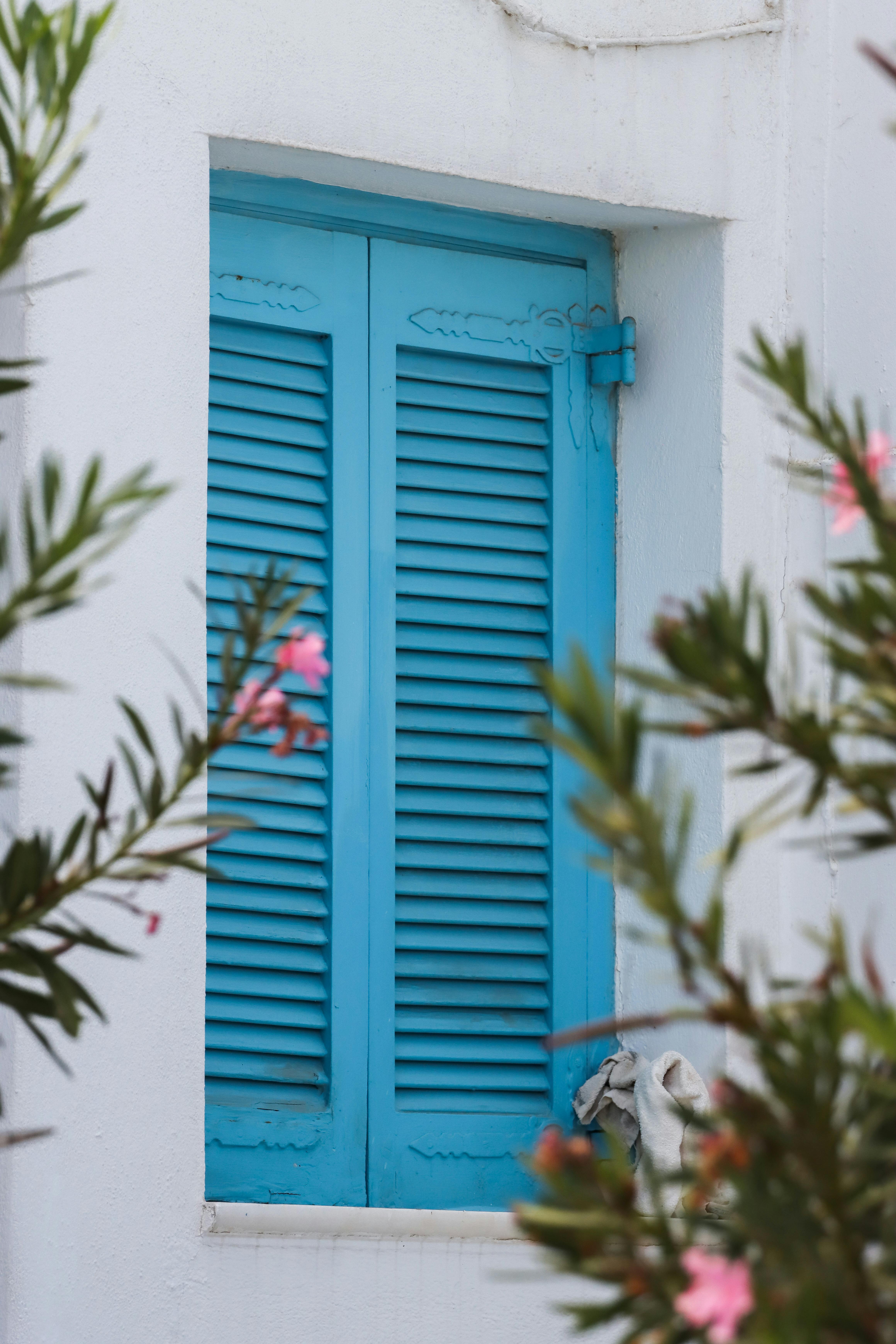 Charming Blue Shuttered Window in Naxos, Greece · Free Stock Photo