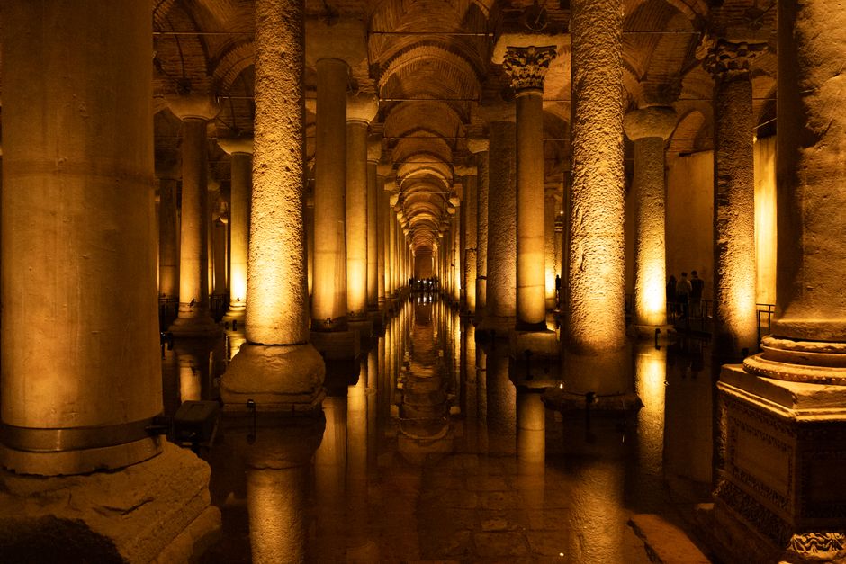 Explore the illuminated arches and columns of the ancient Basilica Cistern in Istanbul.