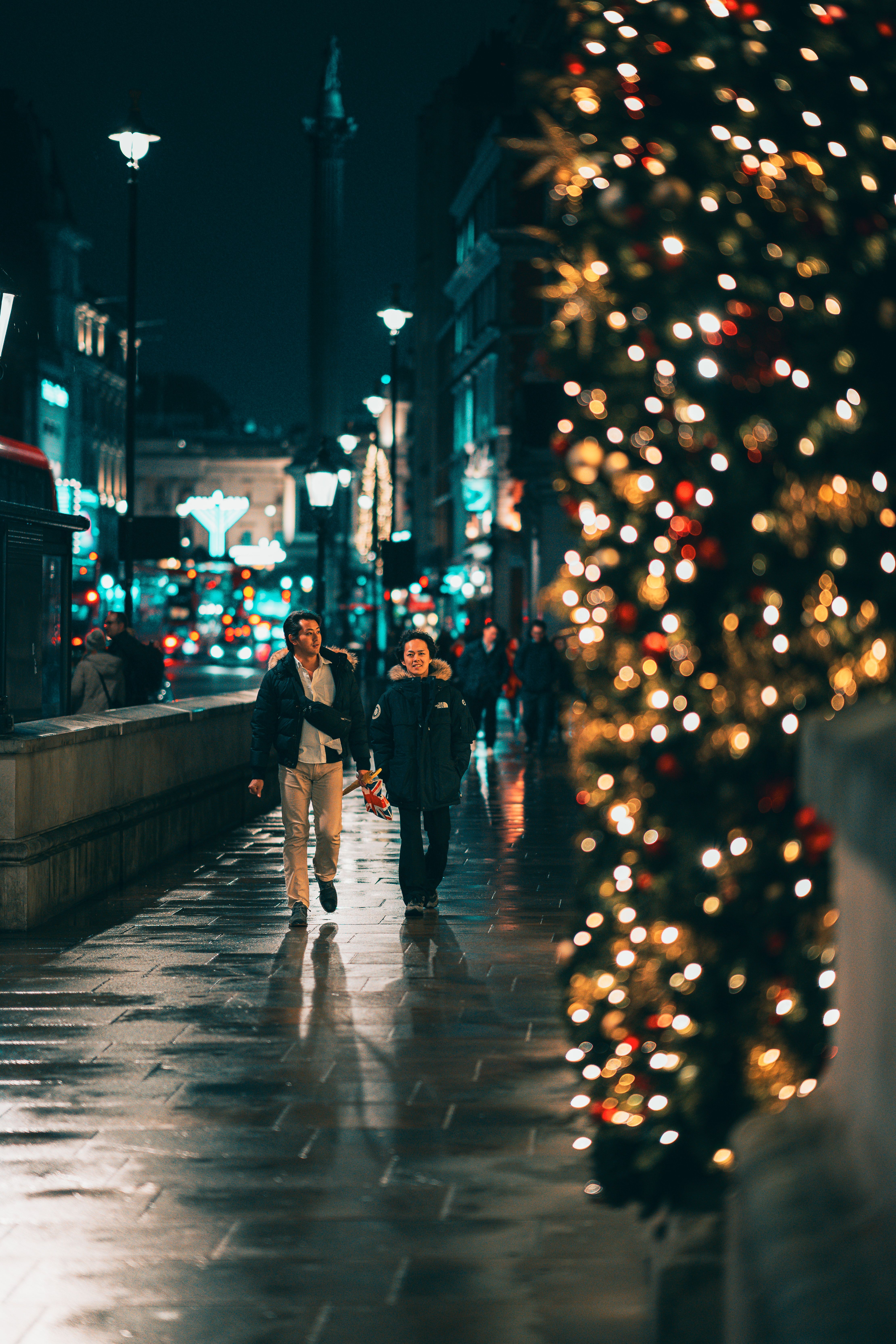Romantic Stroll by Christmas Lights in City · Free Stock Photo