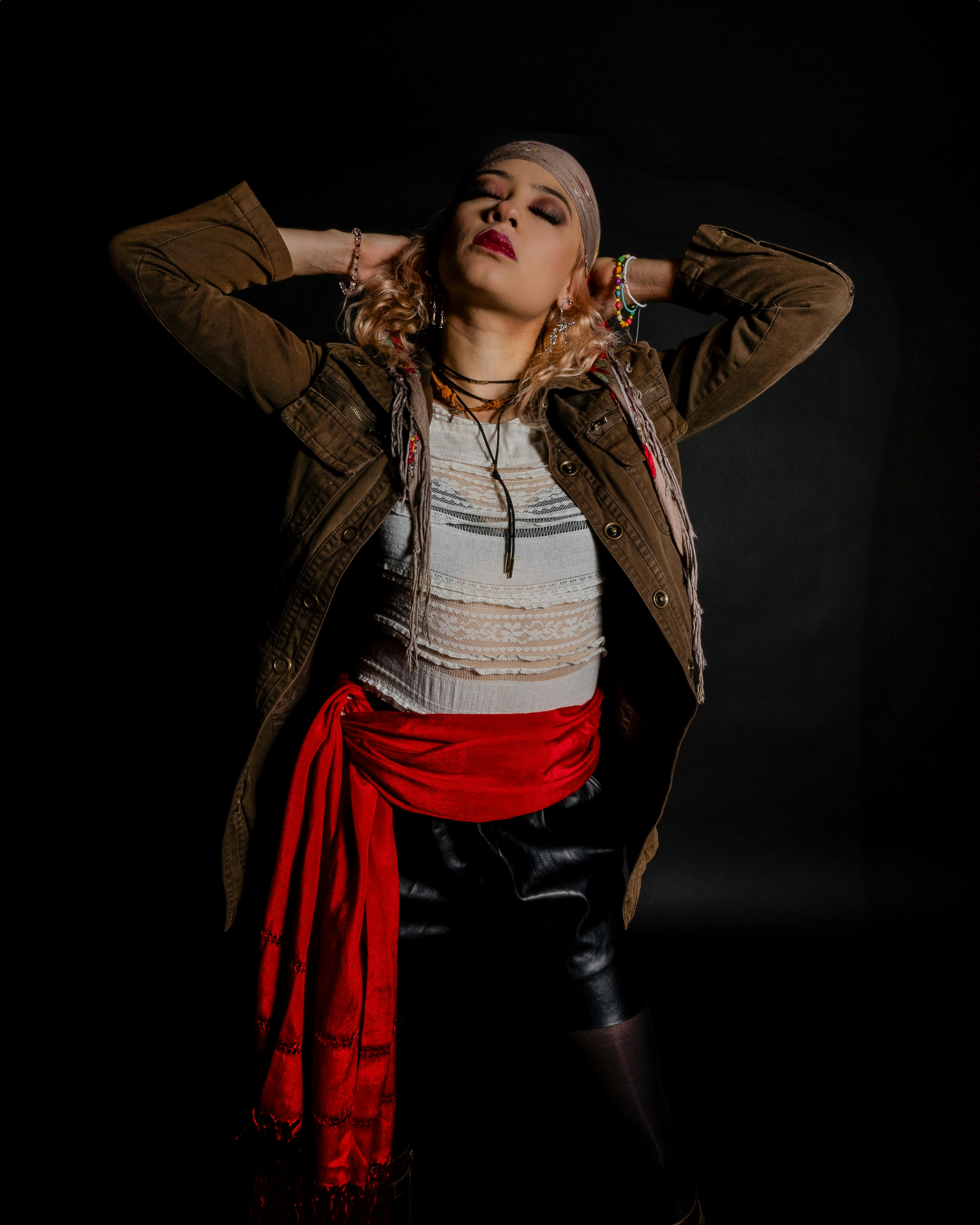 Creative Portrait of a Stylish Woman in Fashionable Pose · Free Stock Photo