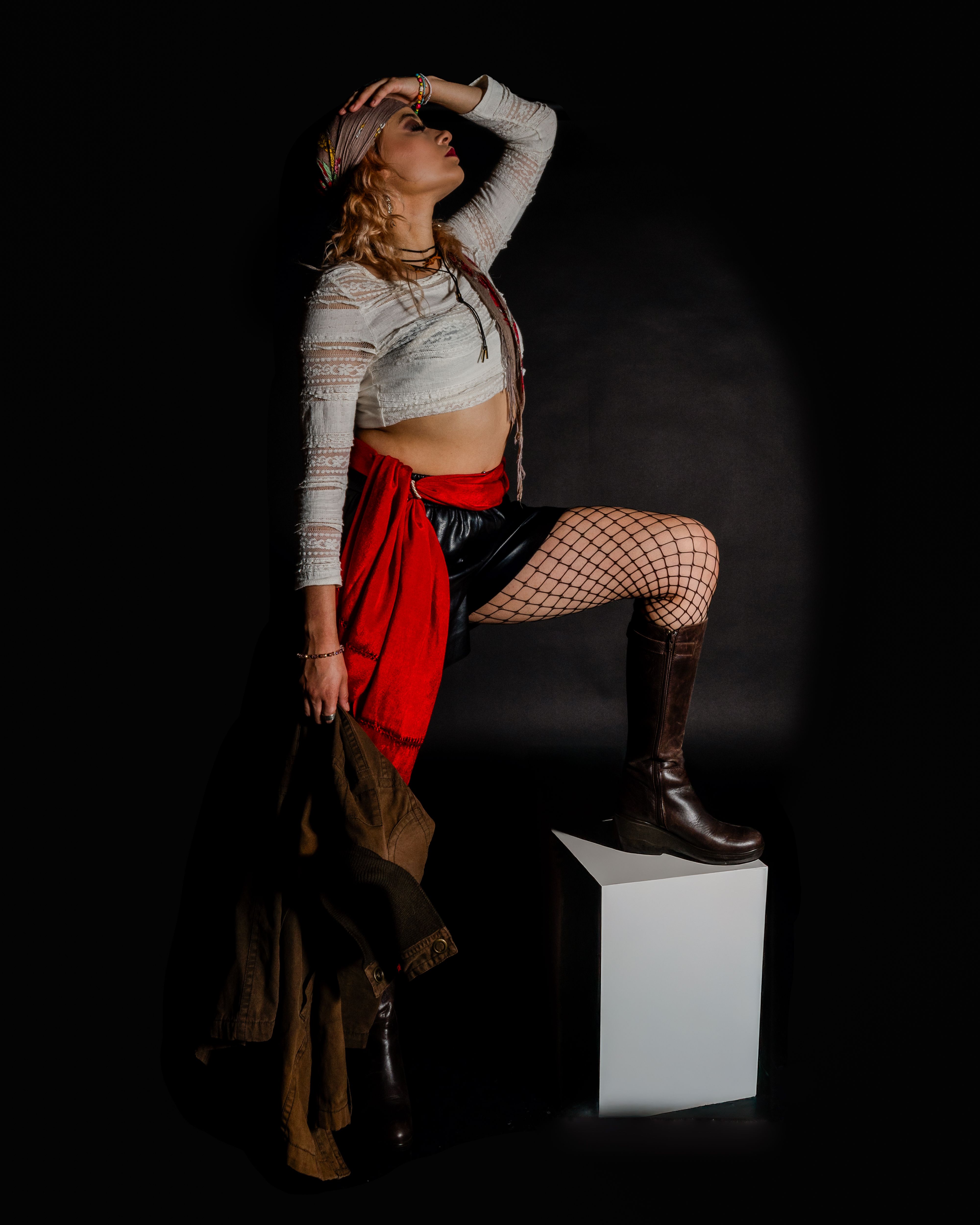 Expressive Dance Pose in Dramatic Studio Lighting · Free Stock Photo