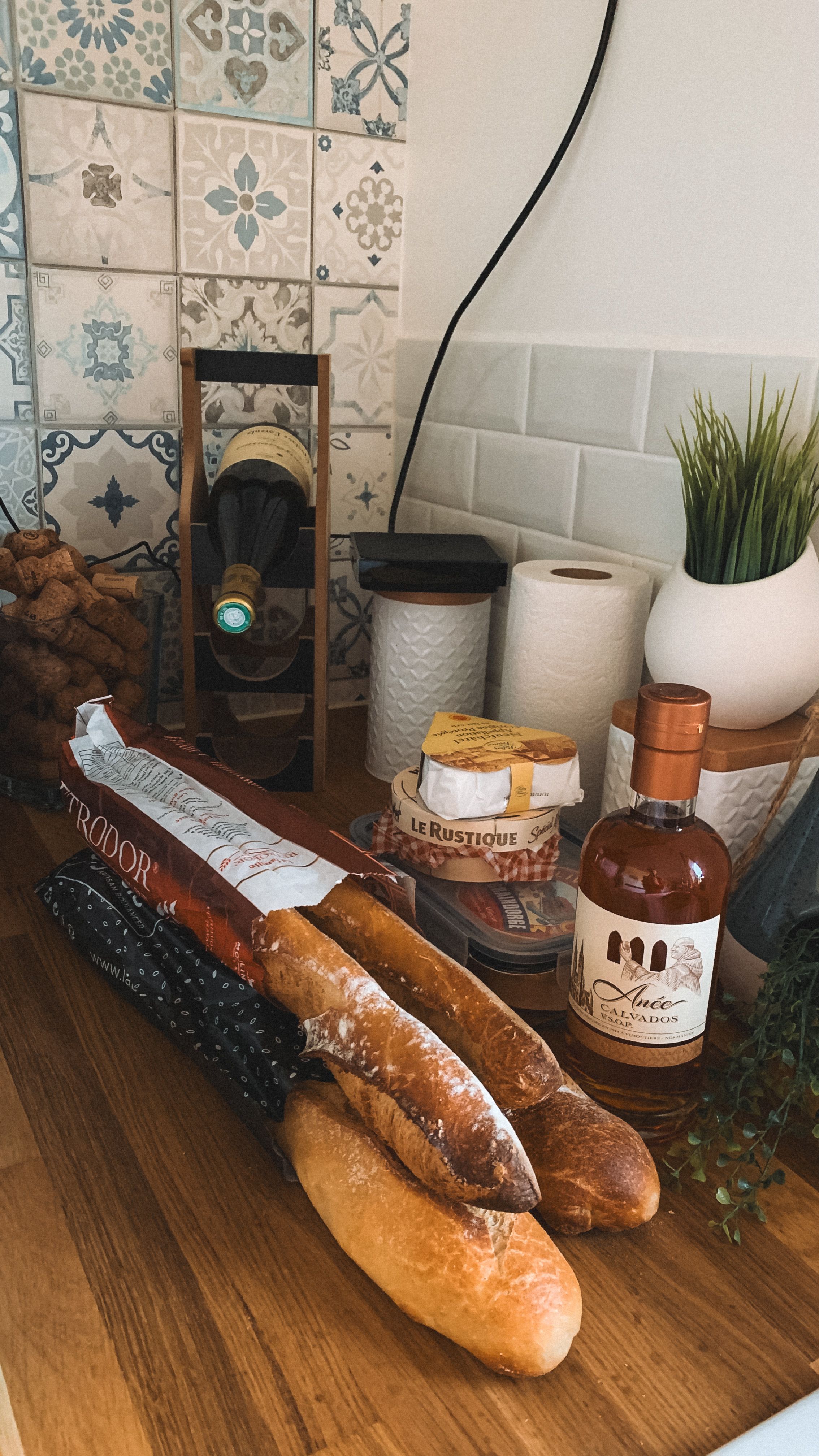 French Kitchen Counter with Baguettes and Wine · Free Stock Photo
