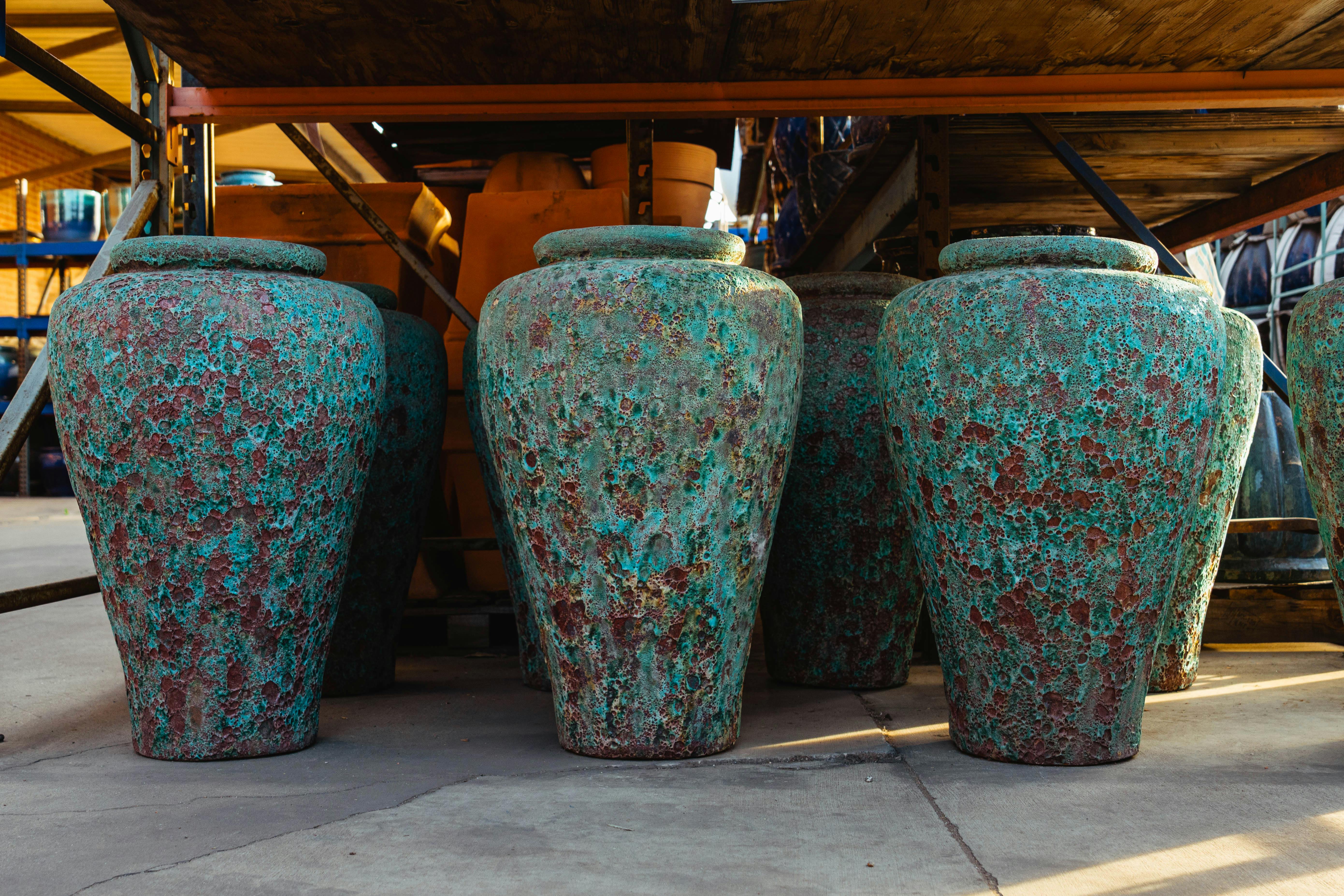 Rustic Turquoise Pottery Vases in Warehouse · Free Stock Photo